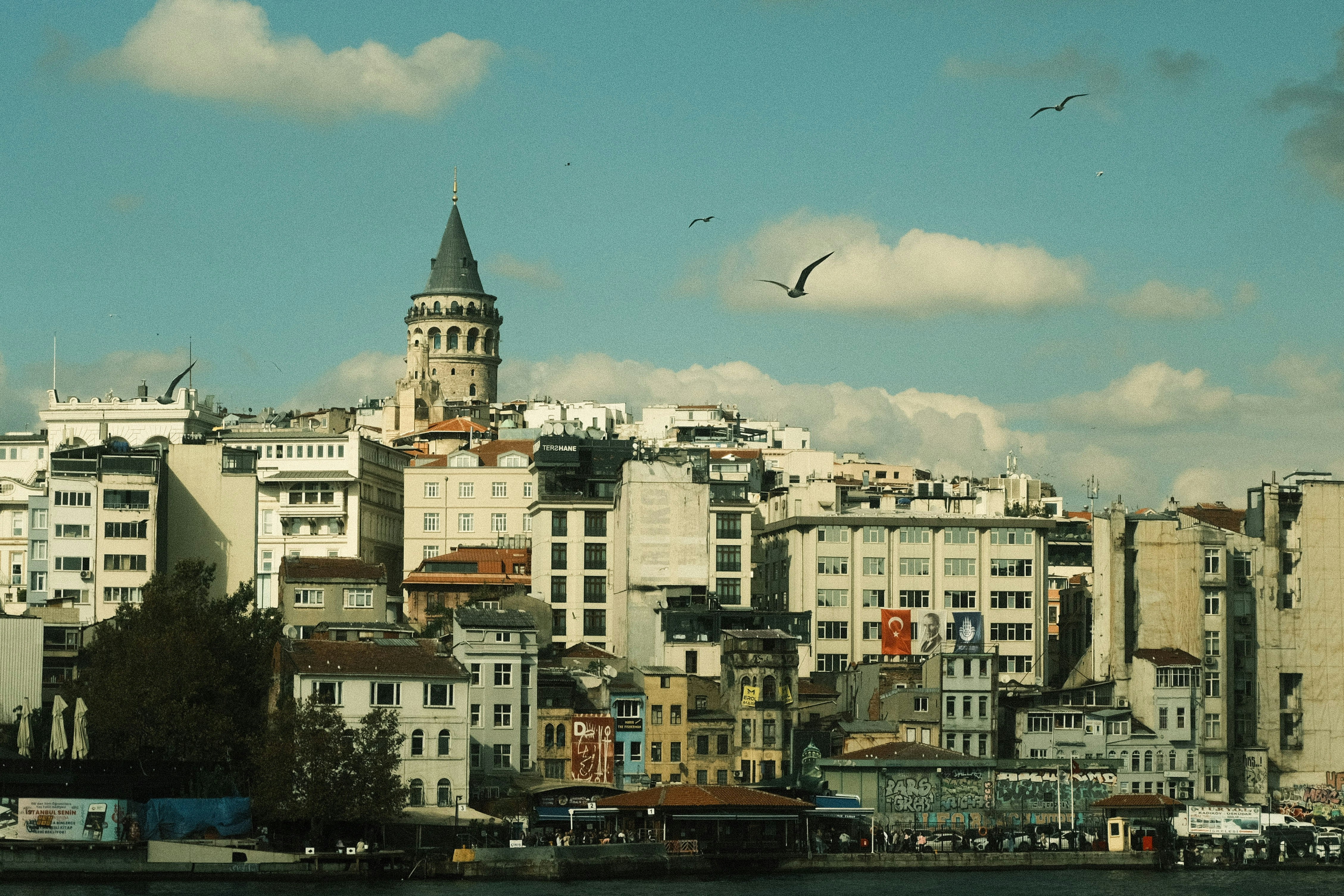Towering Harbor: Istanbul Skyline with a Triumphant Spire
