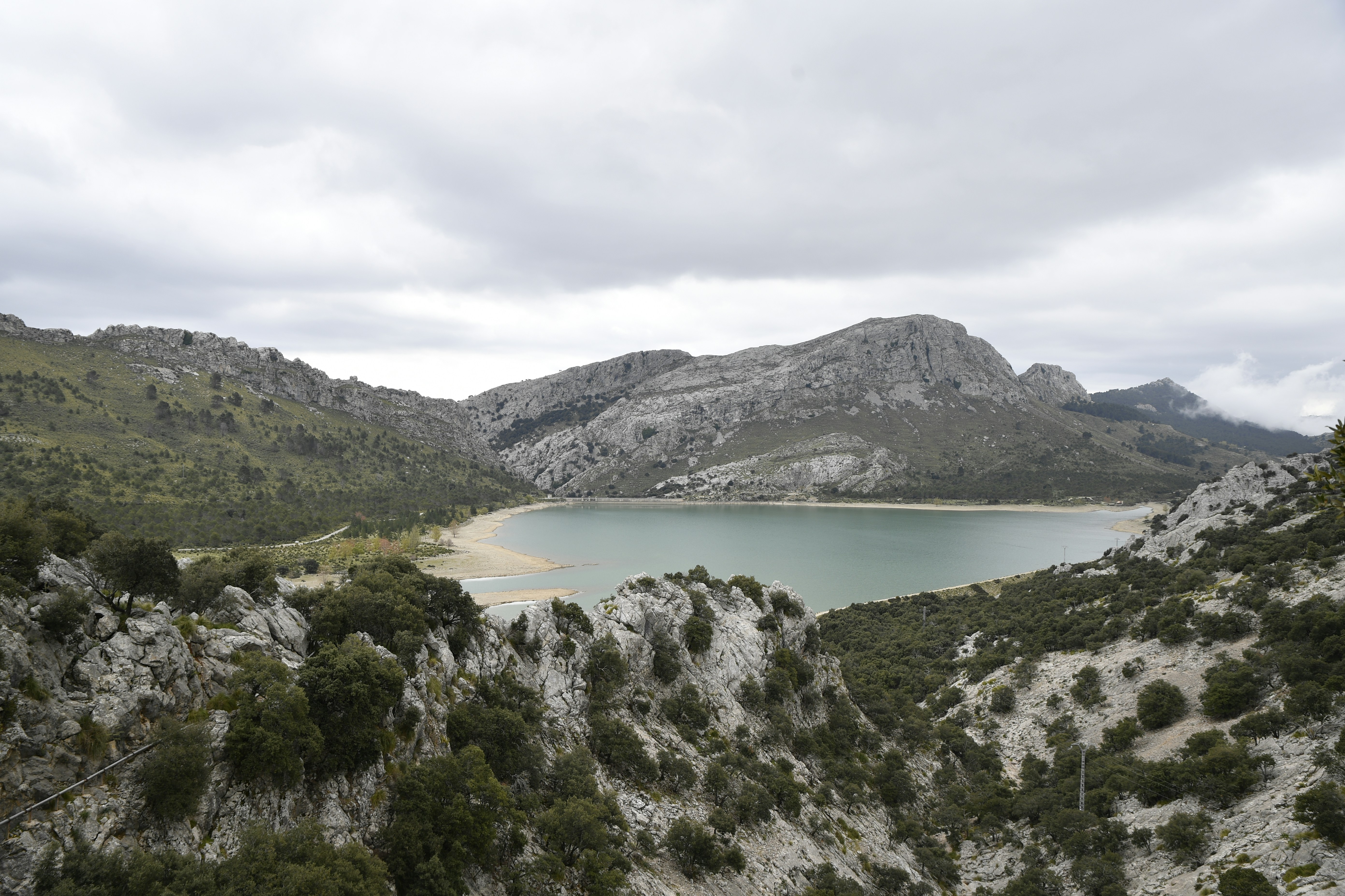 Cove Between Granite Ridges Under Overcast Sky