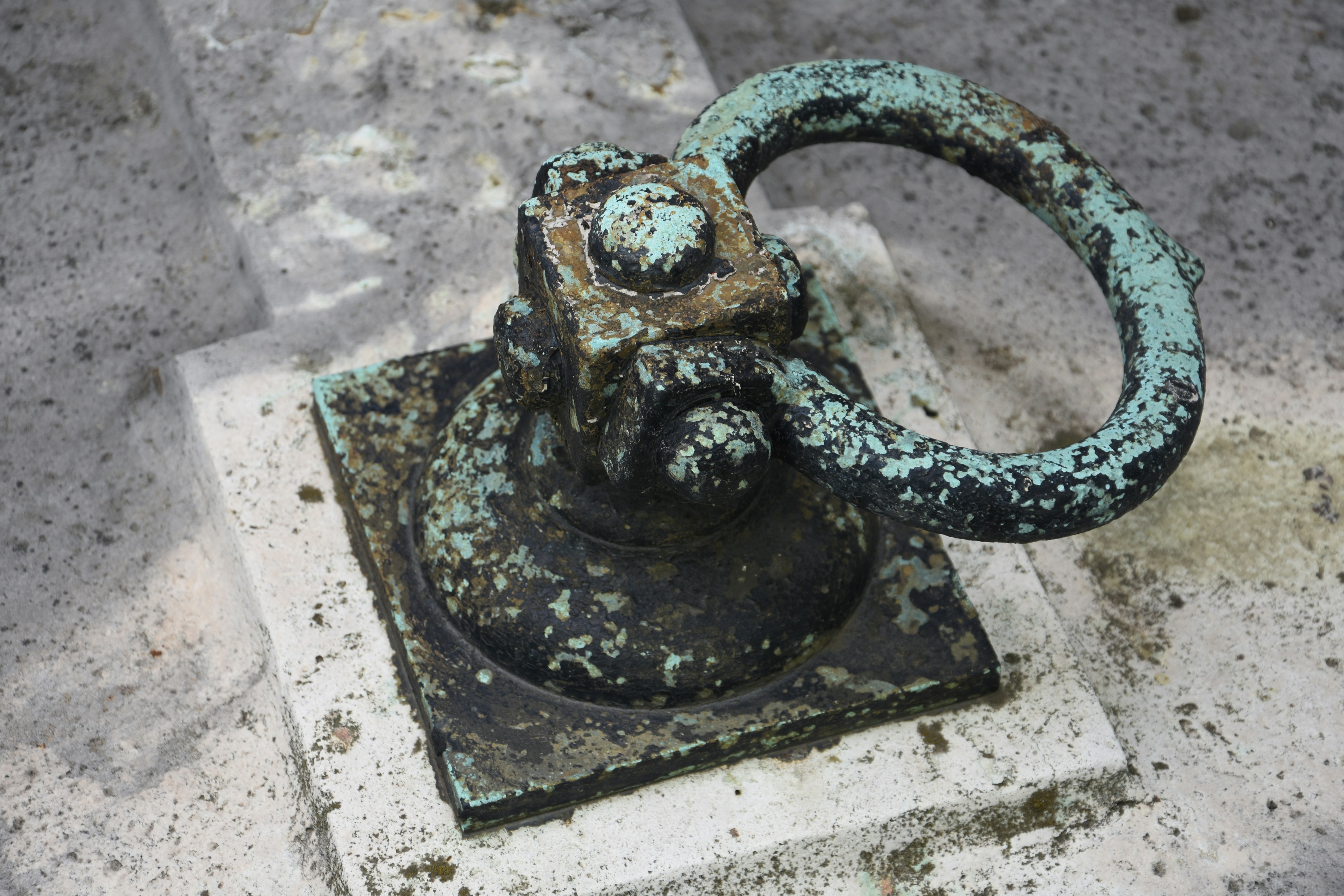 Weathered Gate Valve in a Quiet Concrete Basin