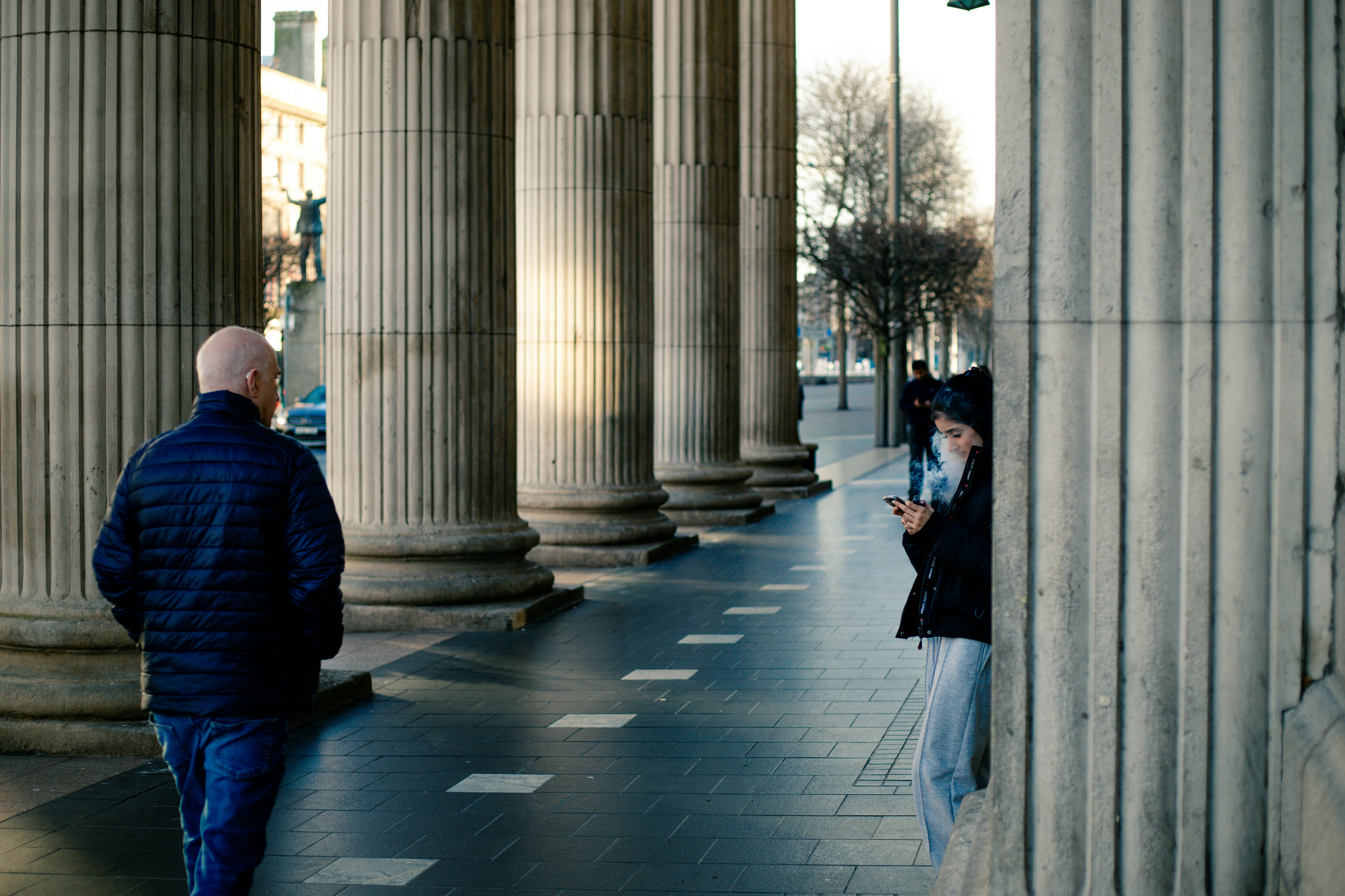 Between Columns: A Quiet Street Encounter