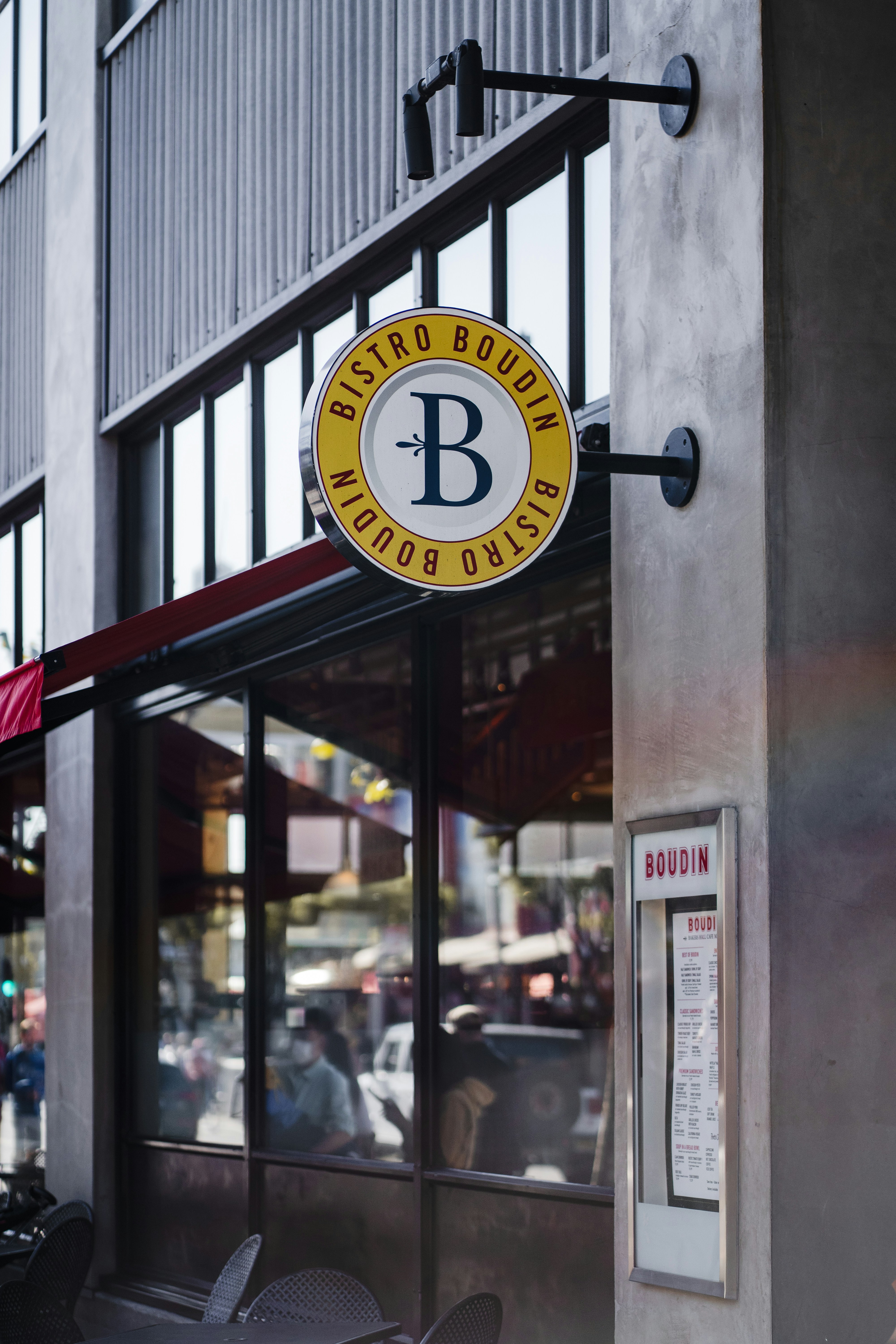 Bistro Boudin Circular Sign Anchors Urban Facade