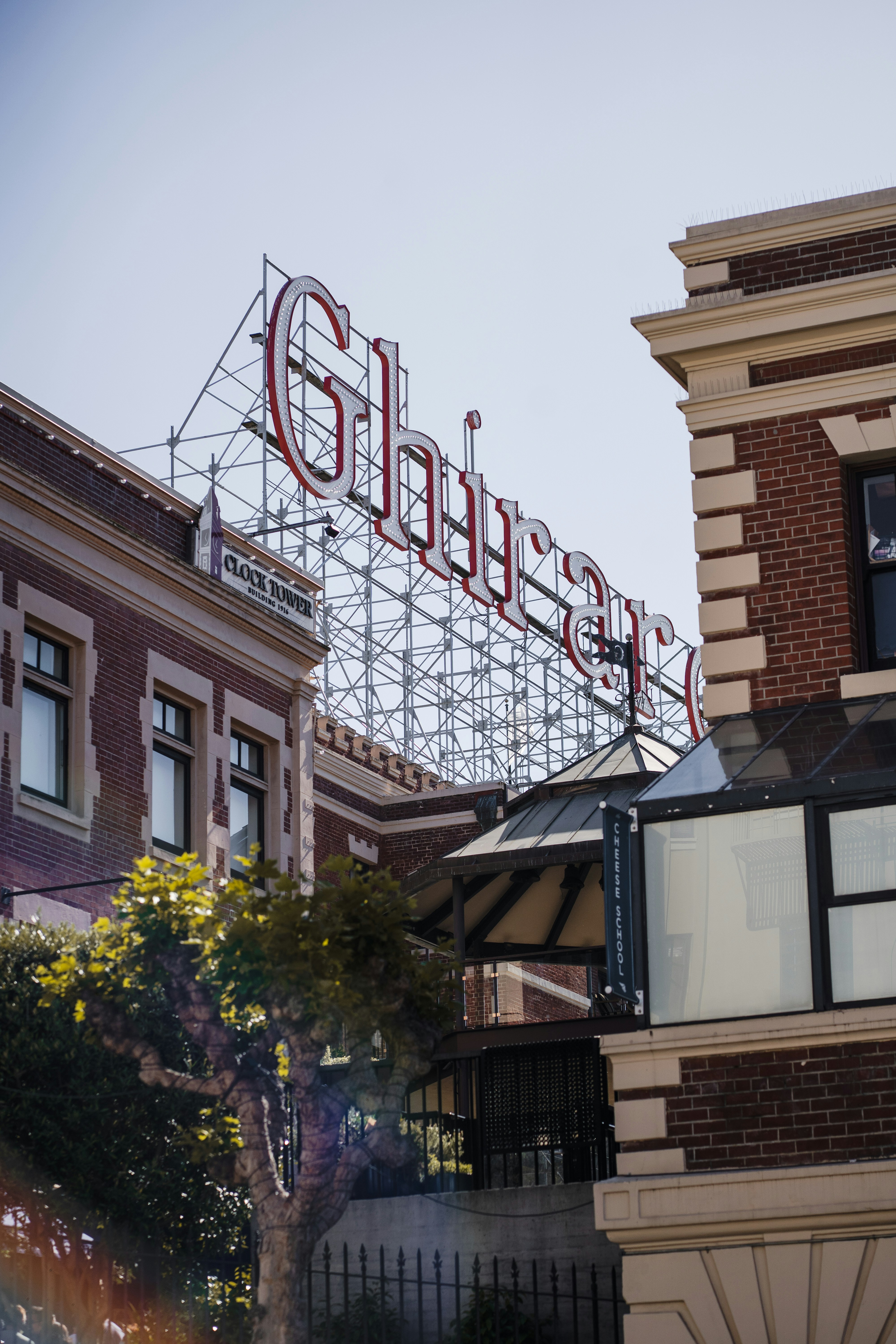 Sign of the City: Ghirardelli Neon over Brick Facades