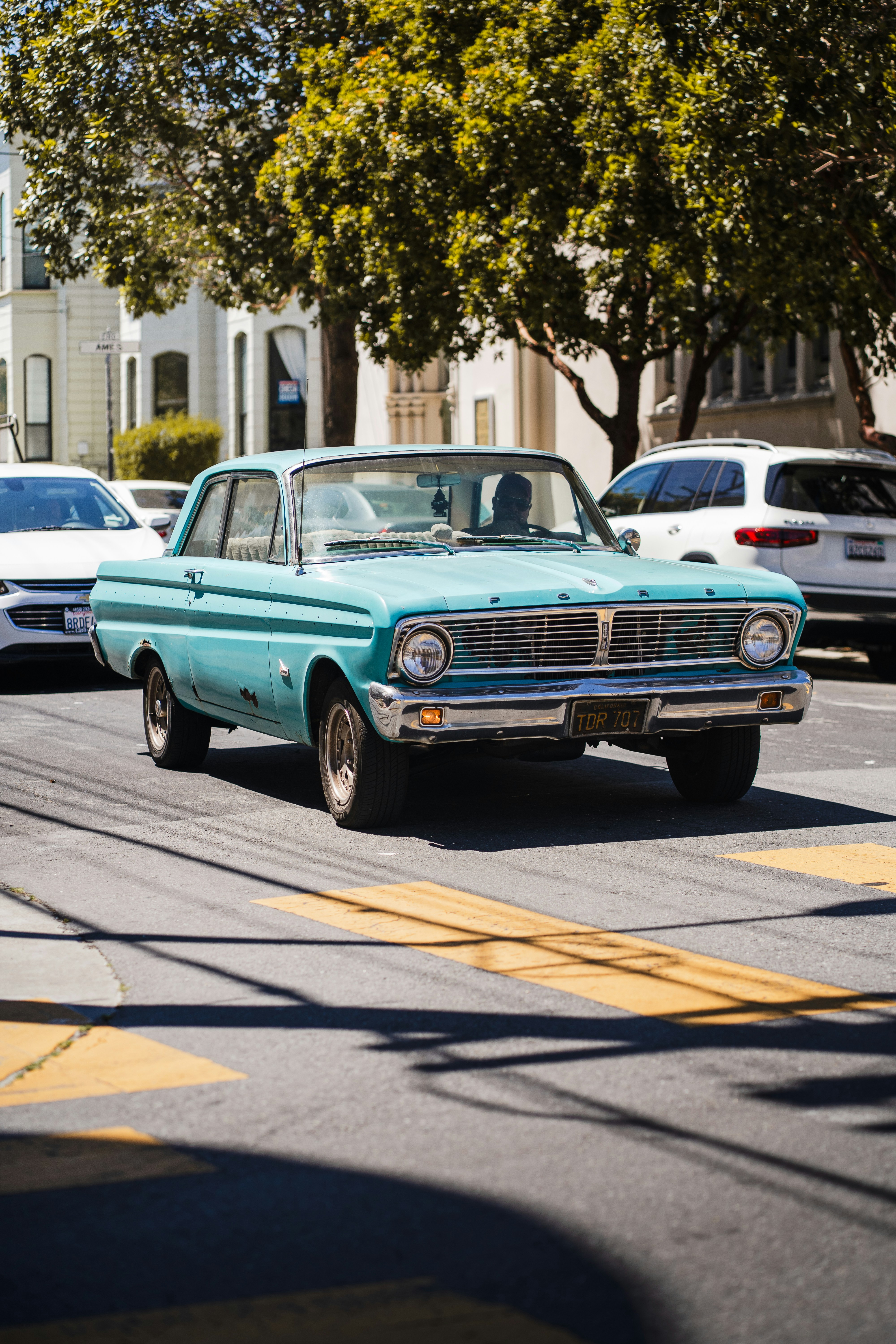 Turquoise Classic on a Sunlit City Street