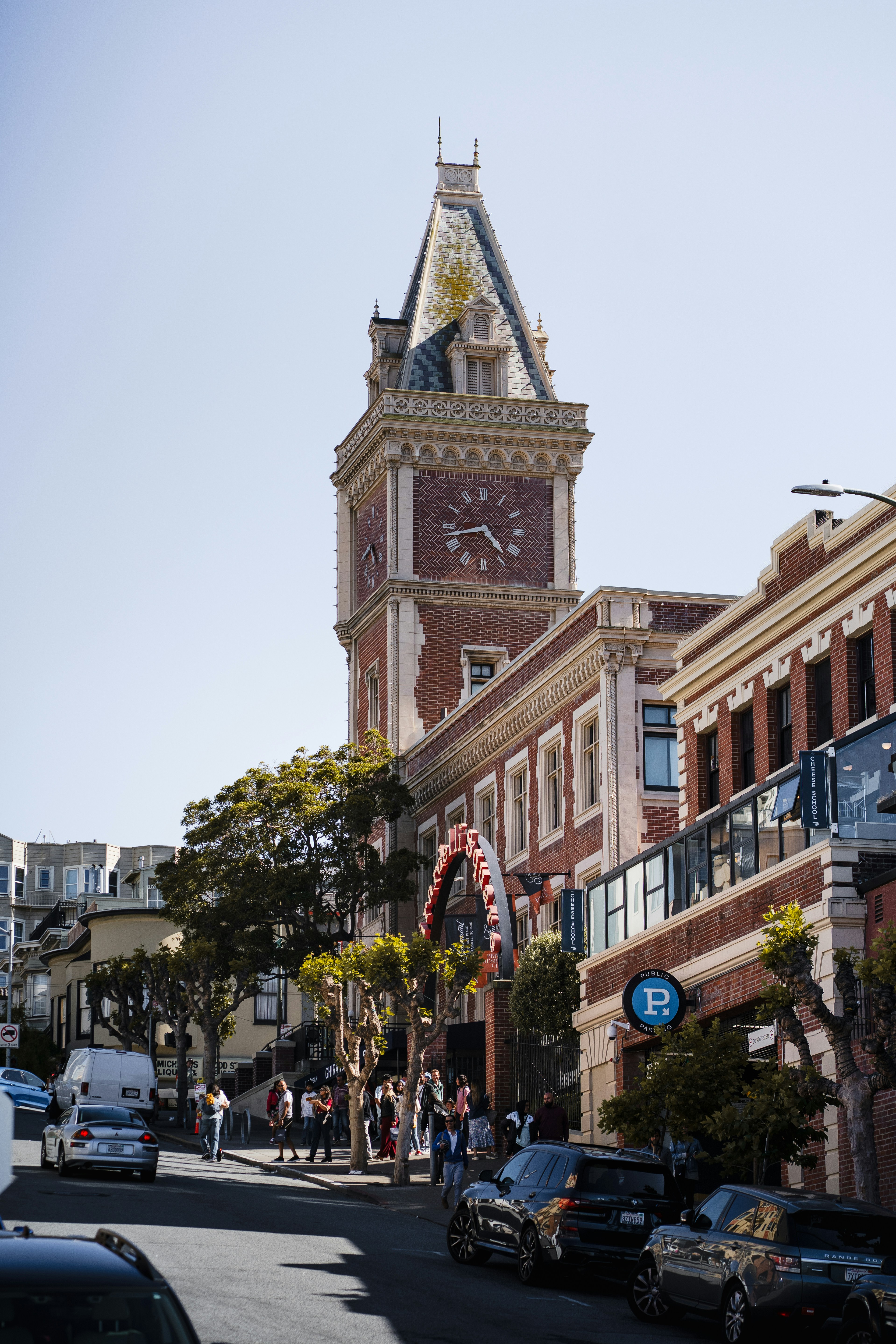 Clock Tower Overlooking a Busy Street