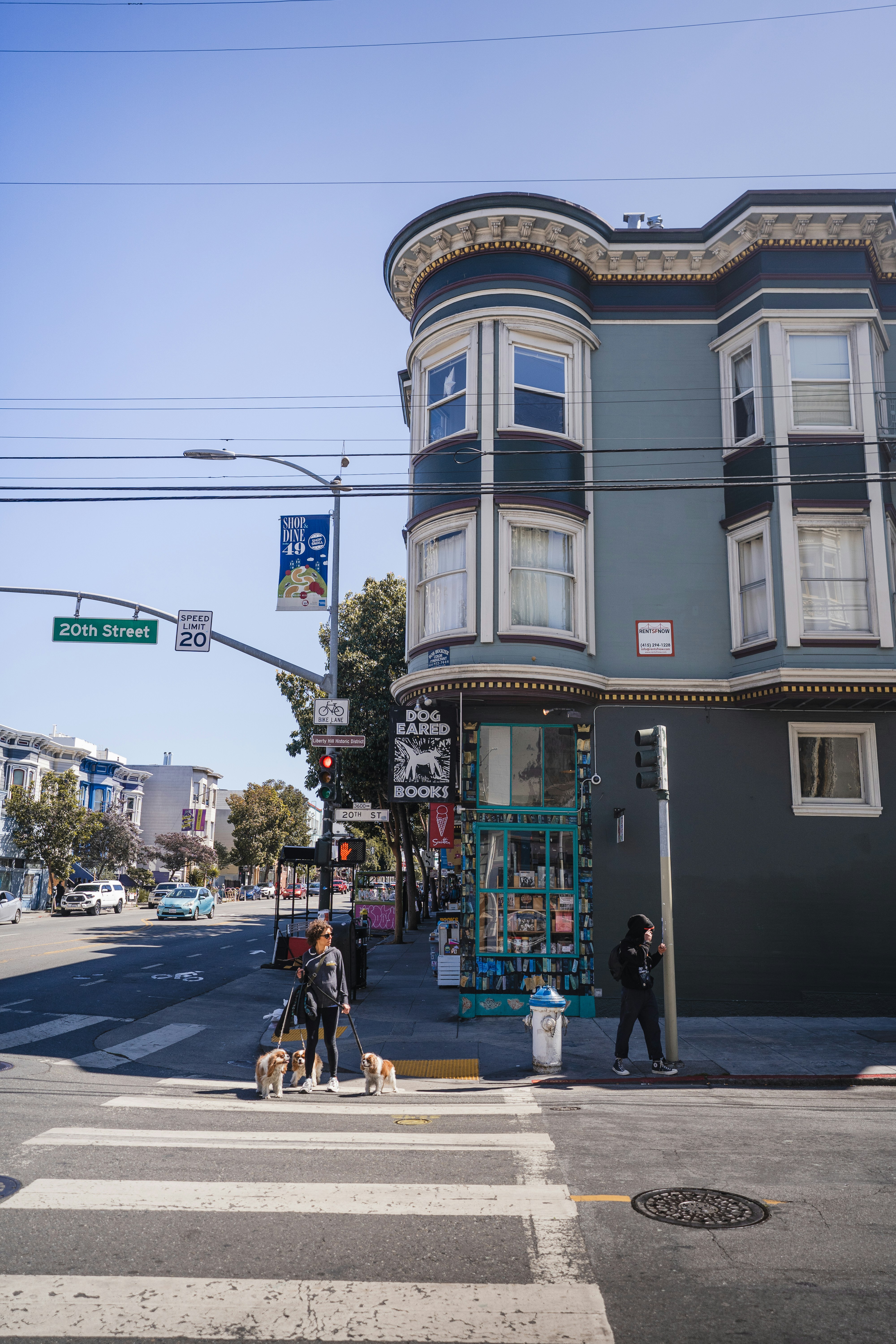 Crosswalk Portrait: Three Figures and Prow of a Victorian Corner
