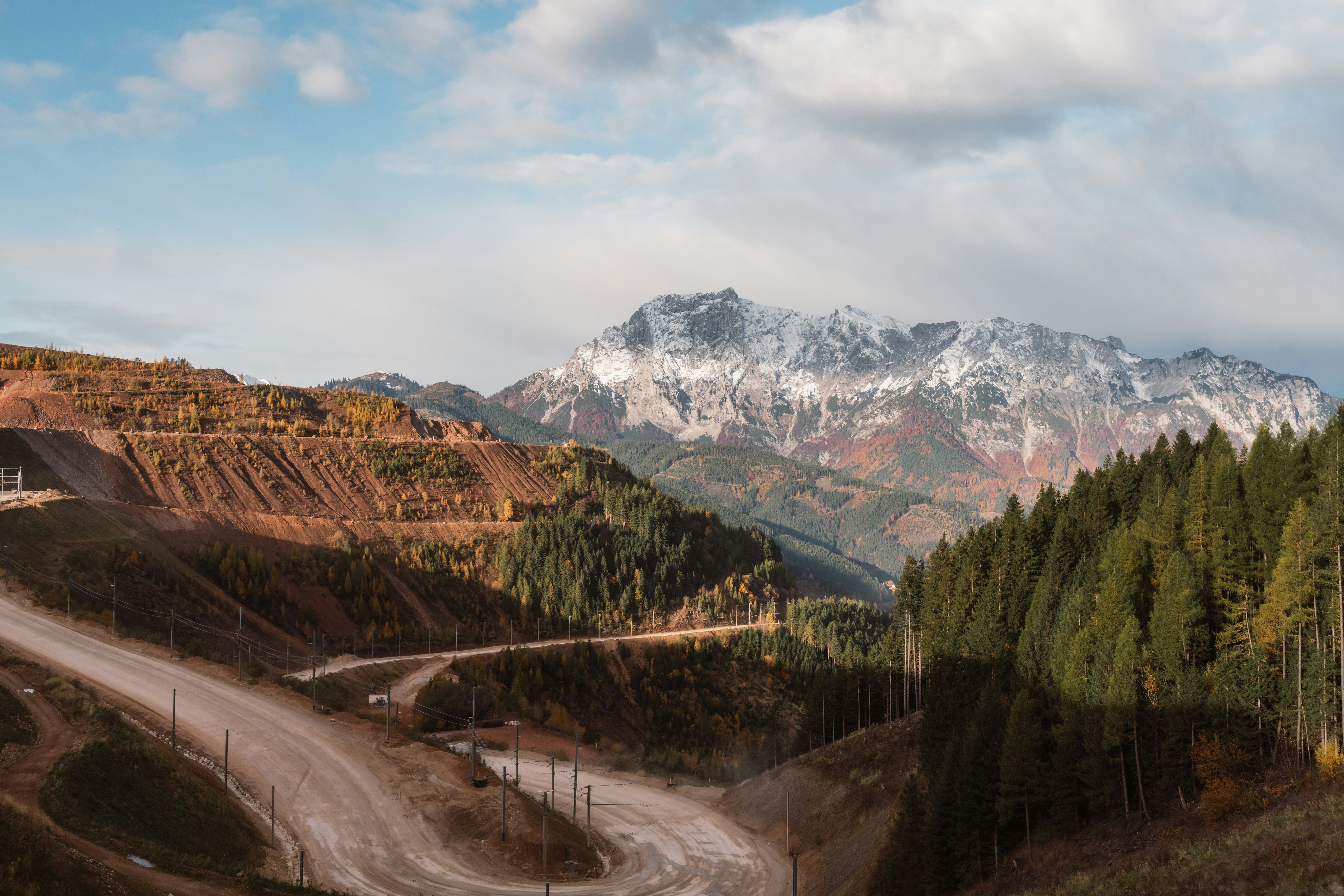 Snow-kissed Peaks Meet Winding Canyon Road