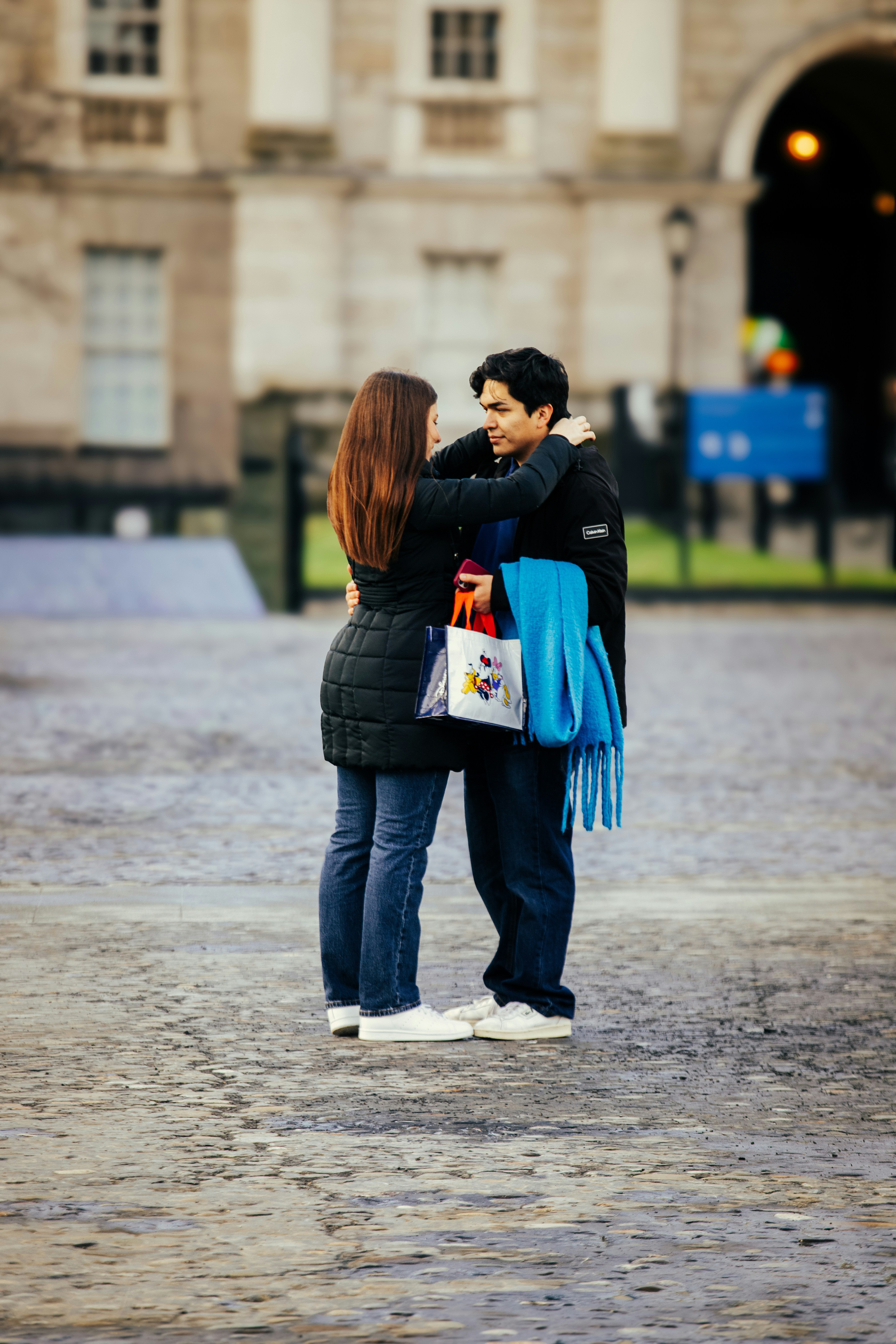 Close Confession on a Cobblestone Square