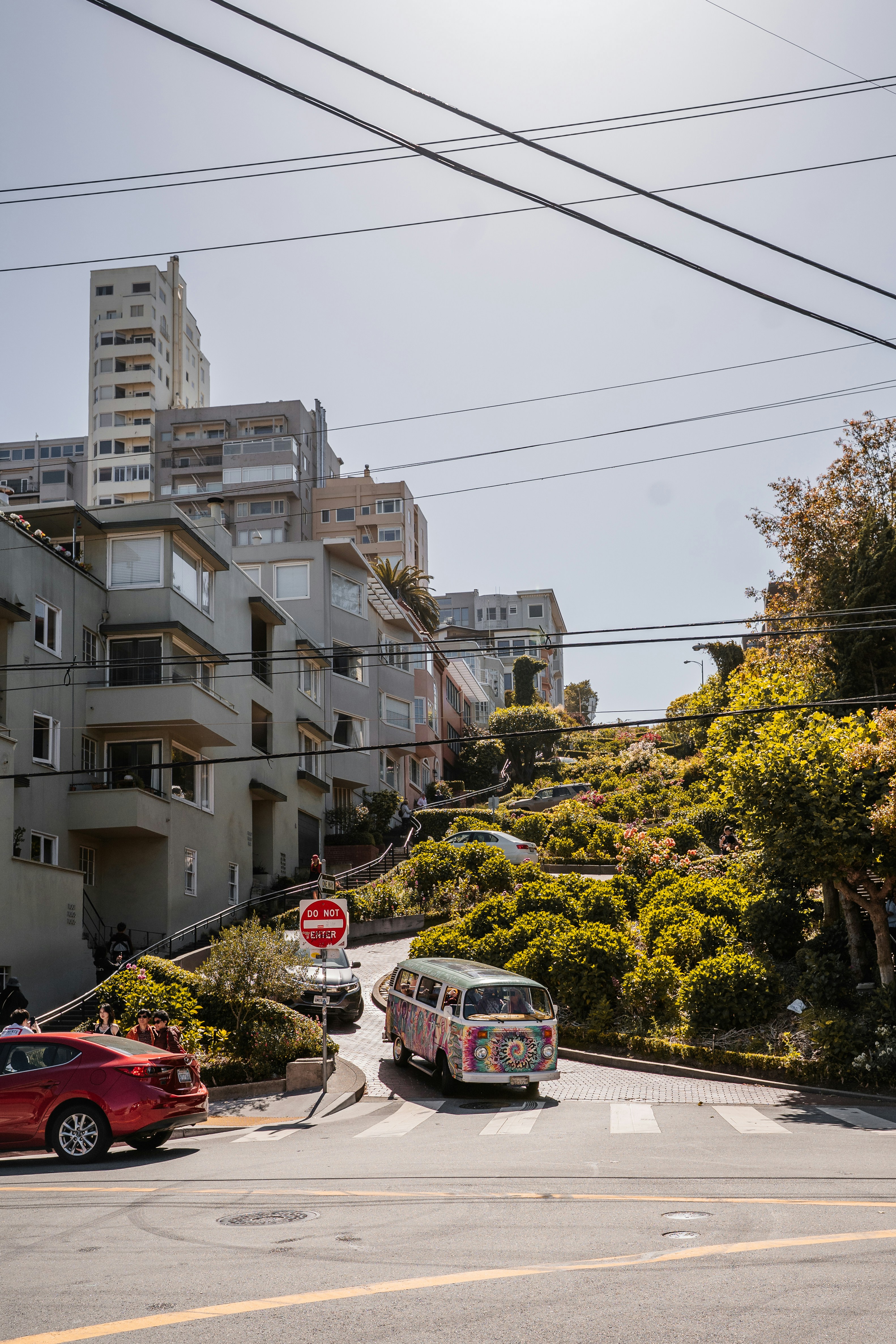 Colorful VW Bus on a Serene San Francisco–Style Street with Soaring Apartment Buildings