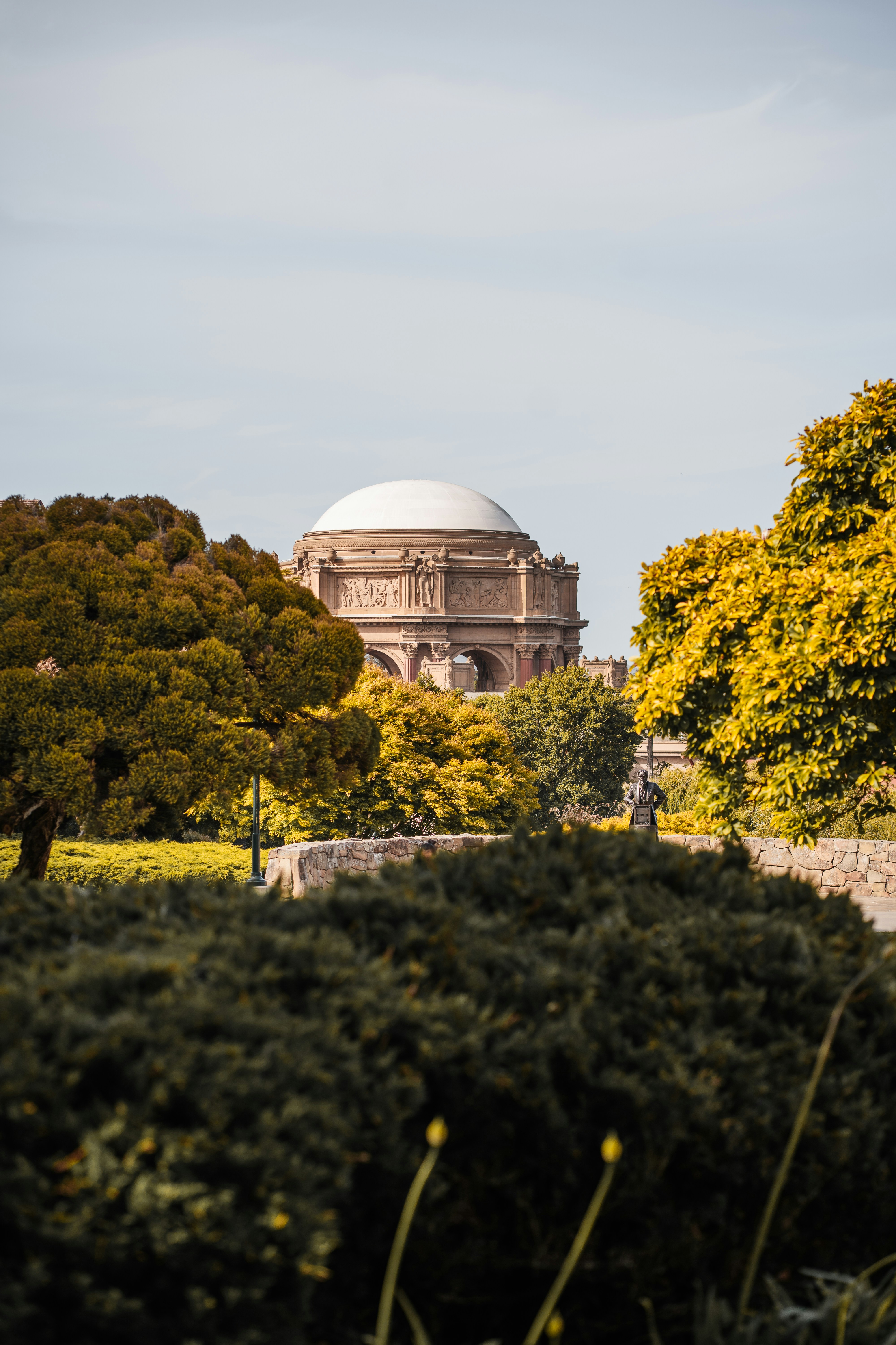 Dome of a Monument Rising Through Autumn Canopy