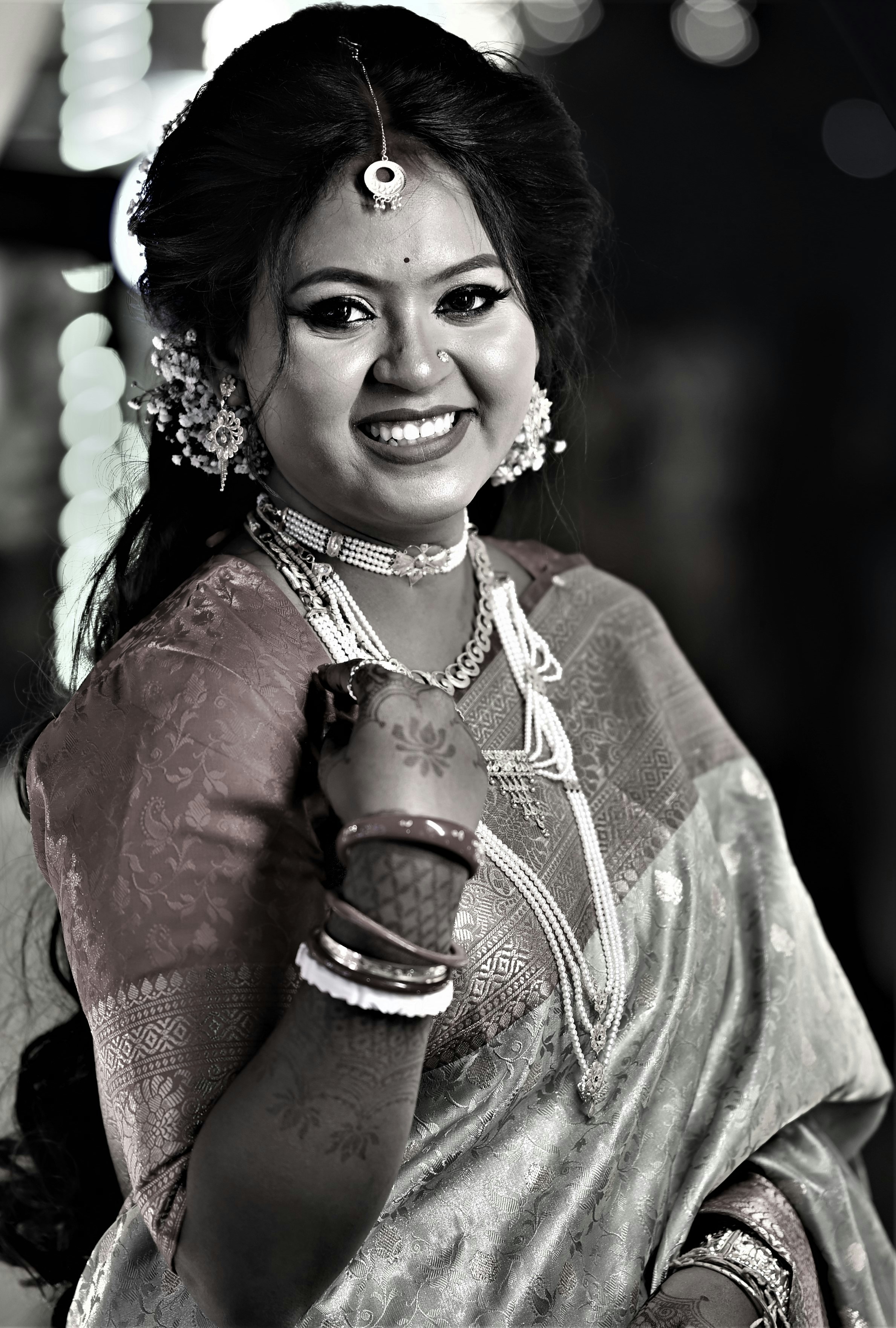 Radiant Bride: Graceful smile and jewelry under soft bokeh