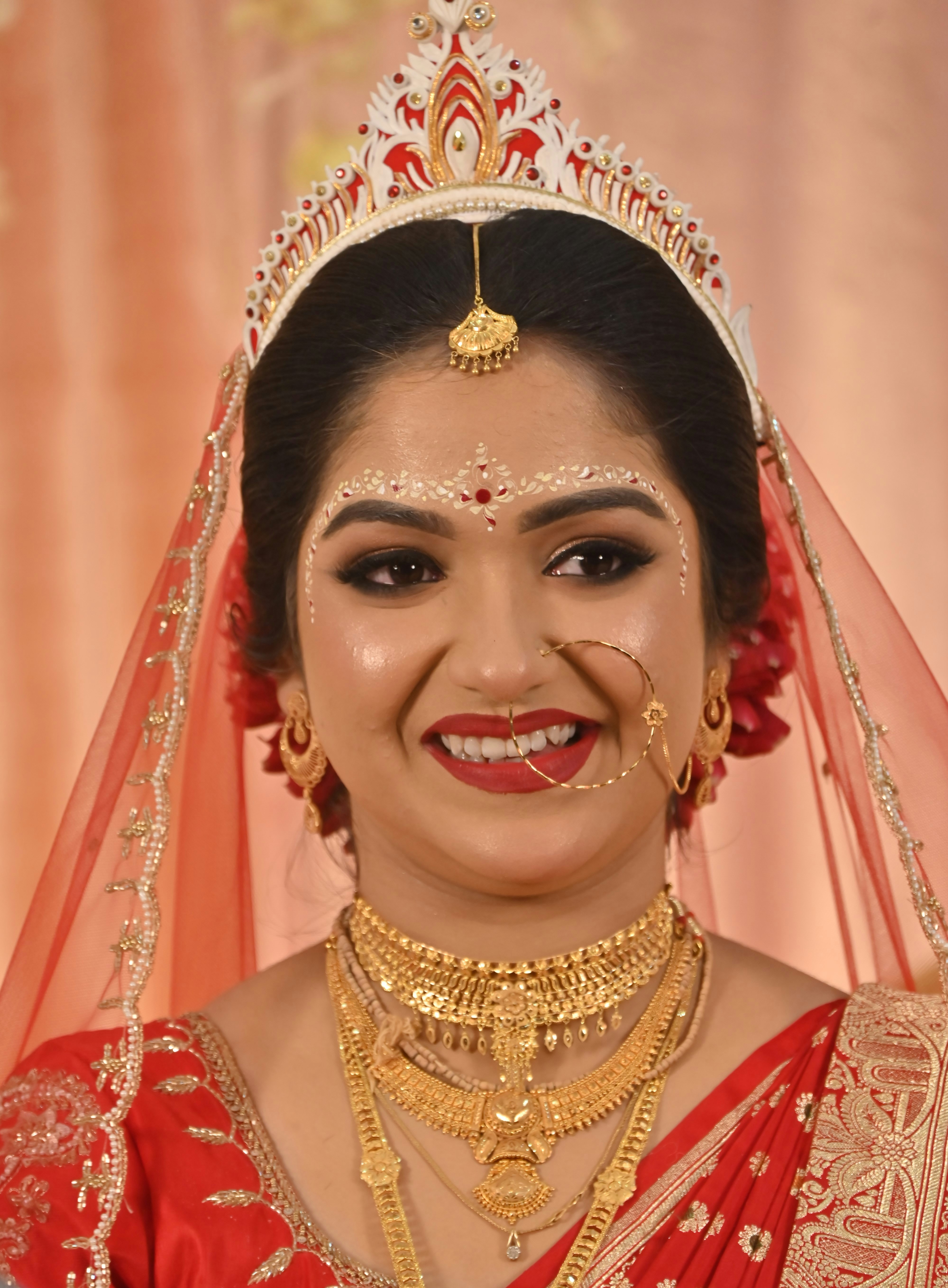 Golden Radiance: Bridal Portrait in Ornate Red