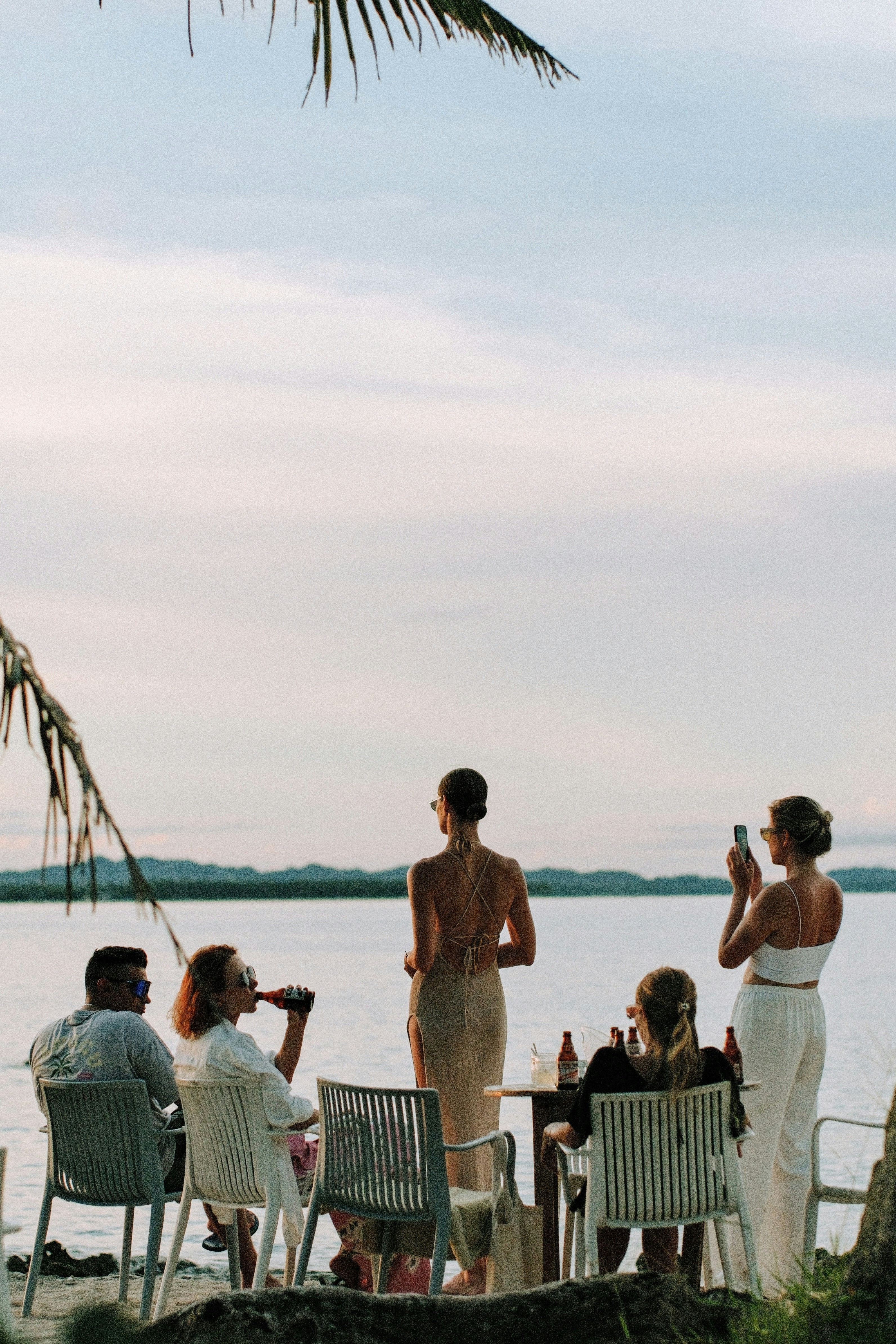 Sunlit Shoreline Portrait: A Quiet Moment Among Friends