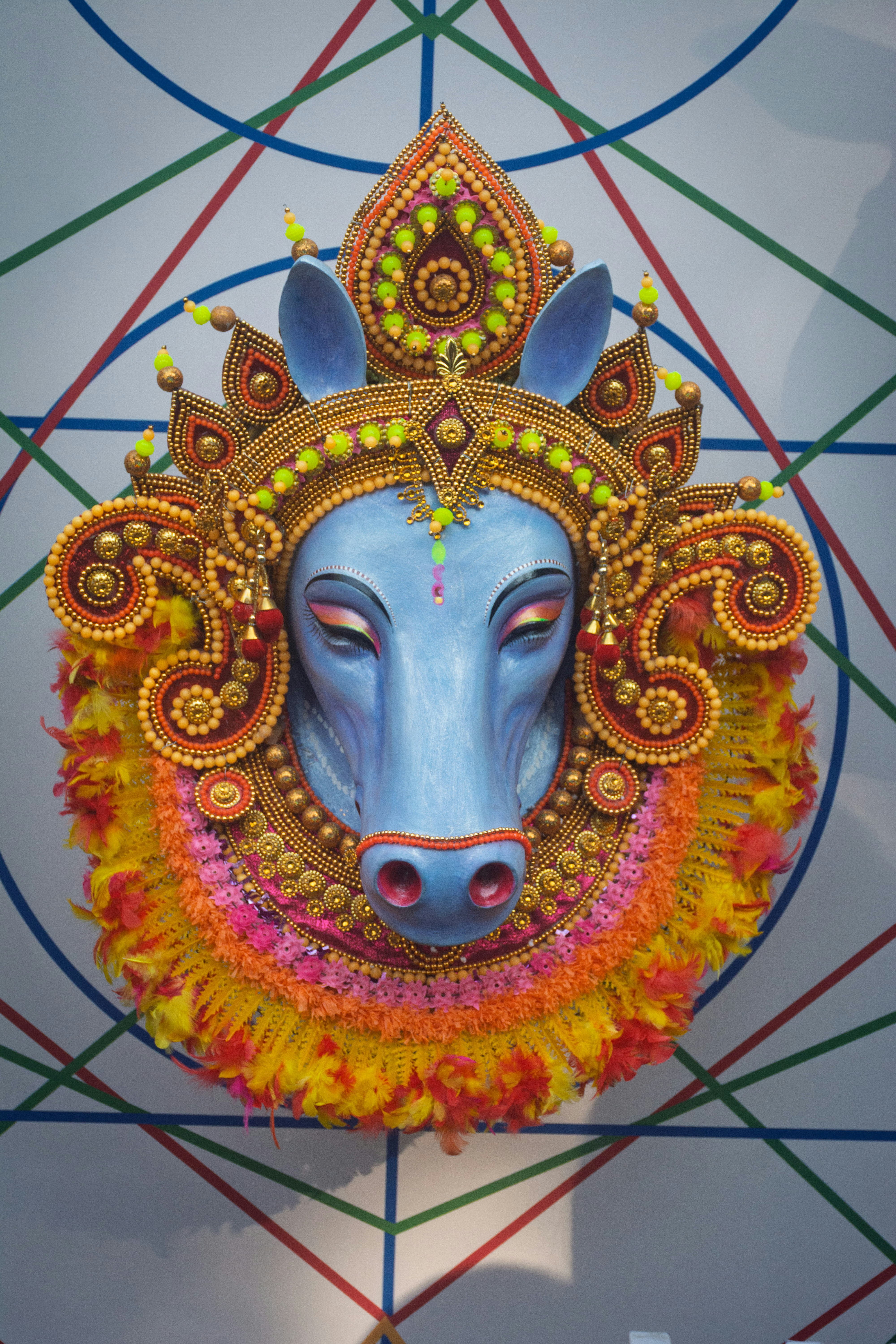 Blue Mask, Golden Mandalas: A Festive Portrait of Colorful Craft