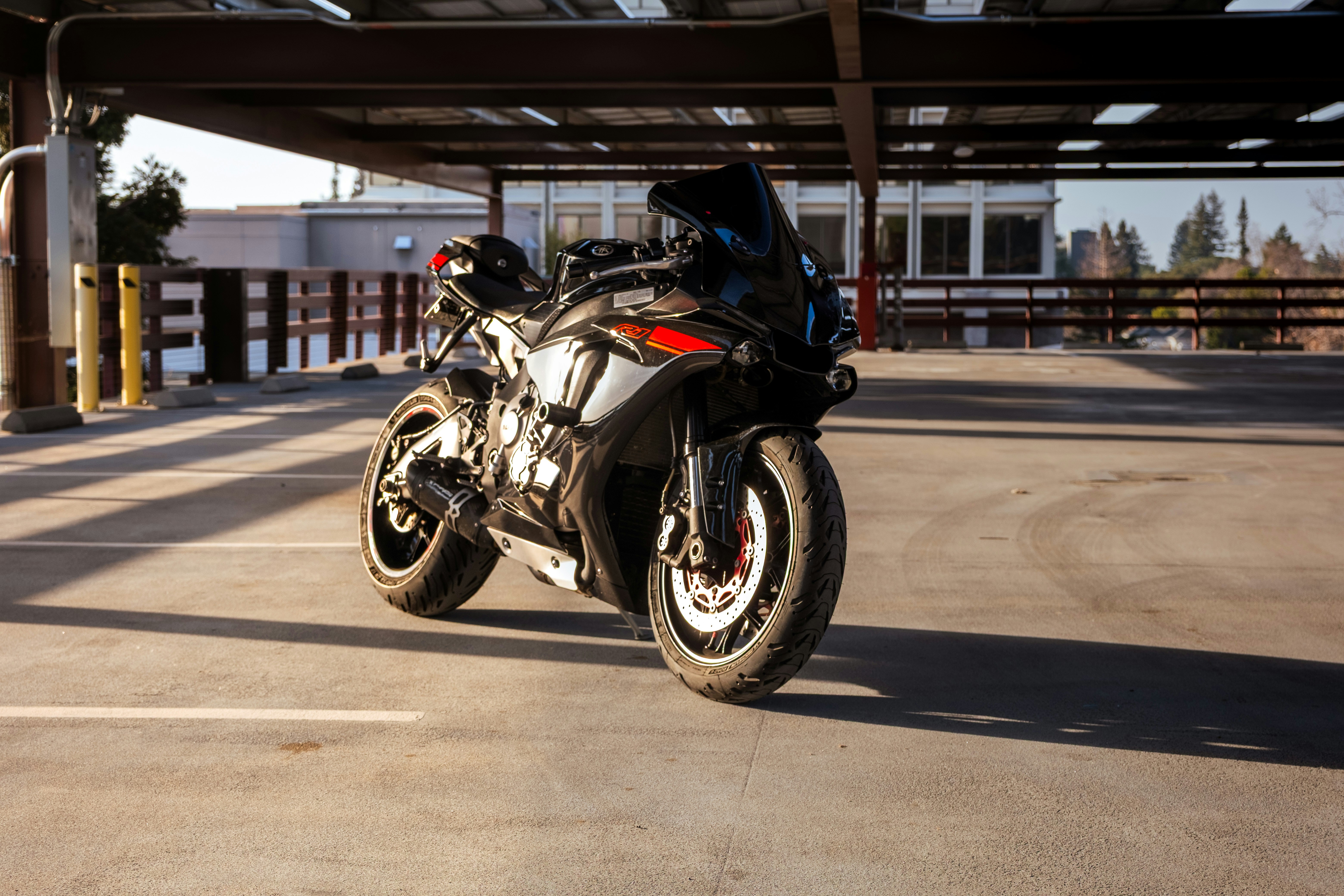 Rider’s Machine: A Silver Sport Coupe Lands in Sunlit Parking