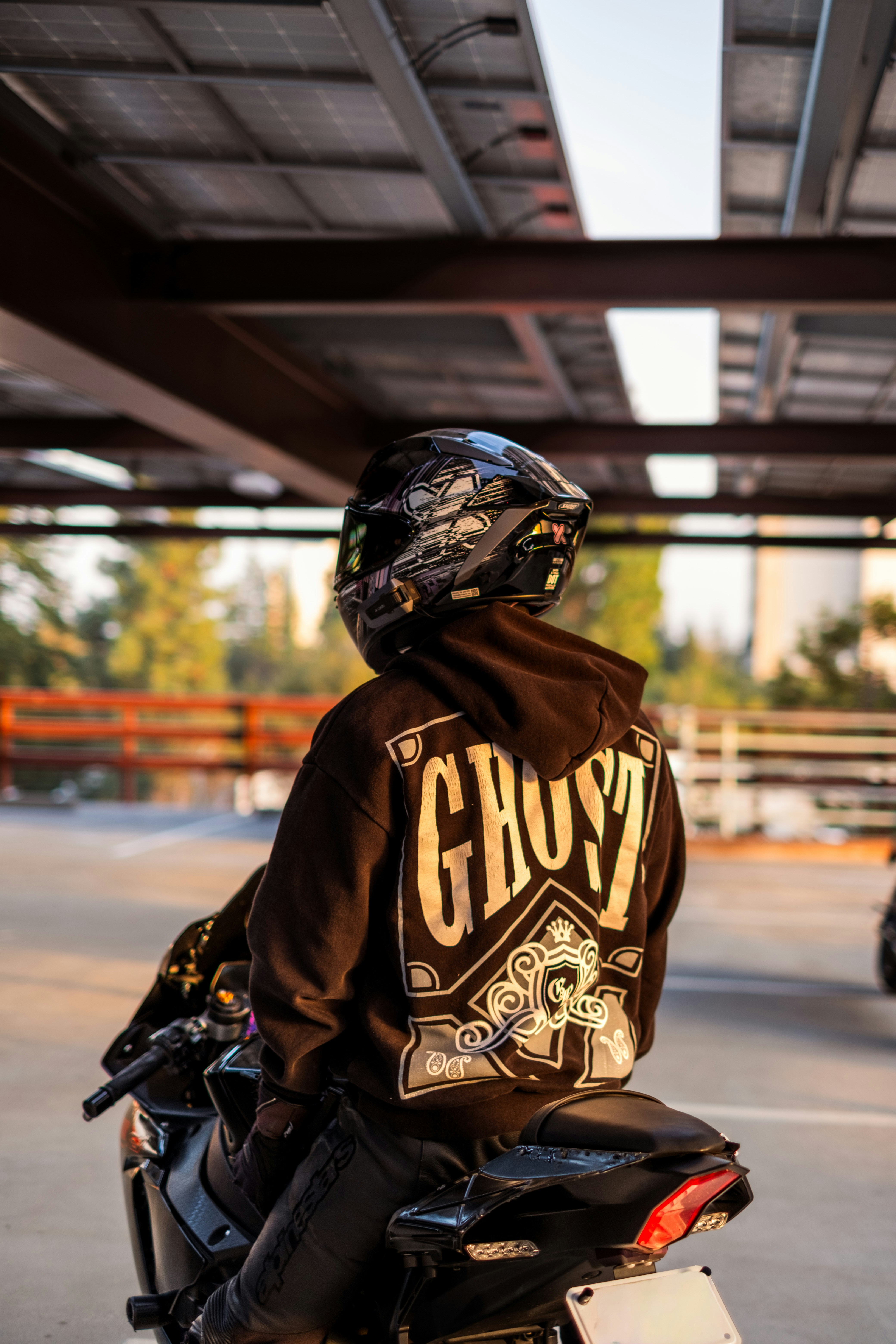 Motorcycle Hooded Rider Under Industrial Canopy