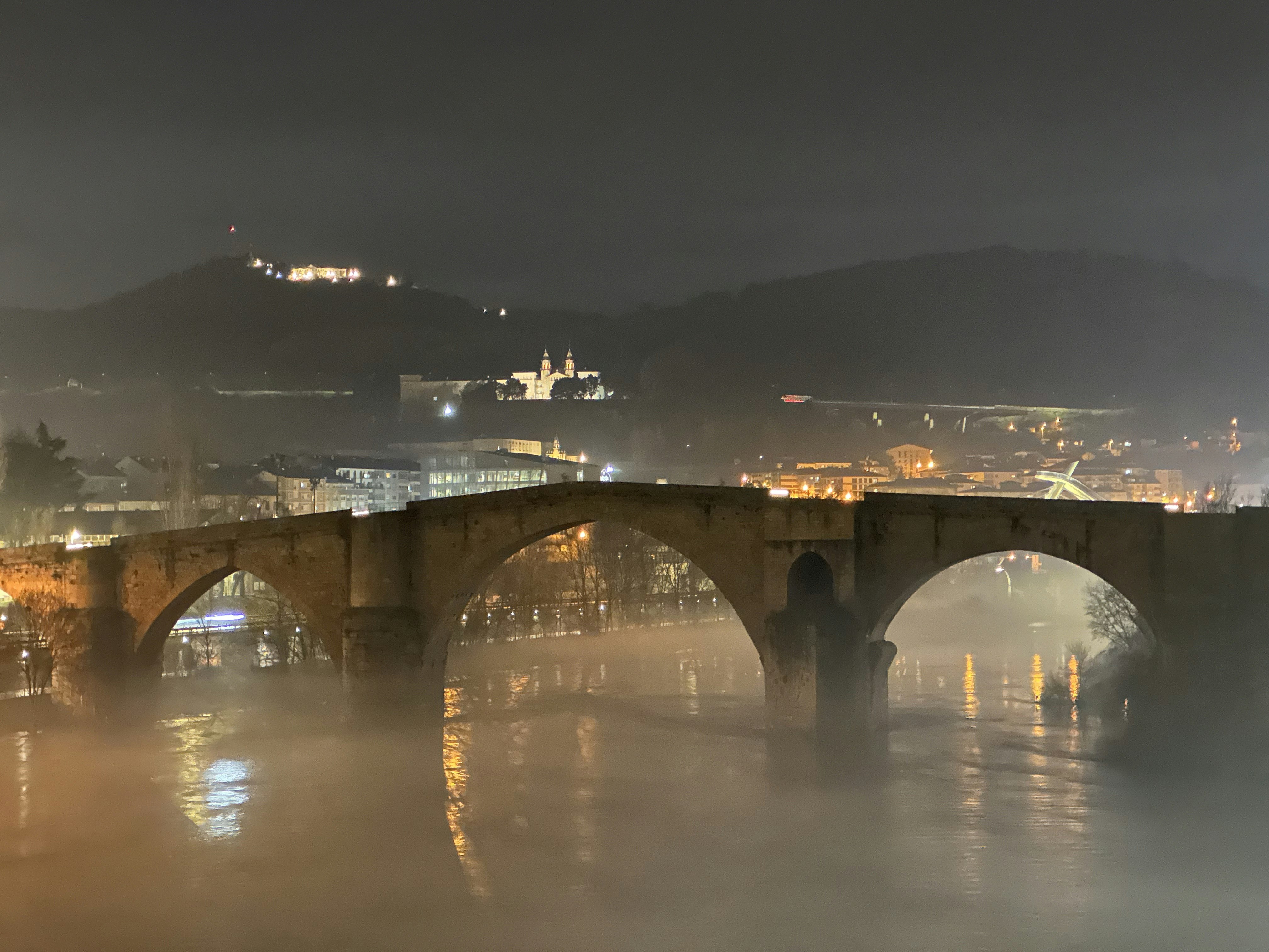 Moonlit Archways Over a Calm River