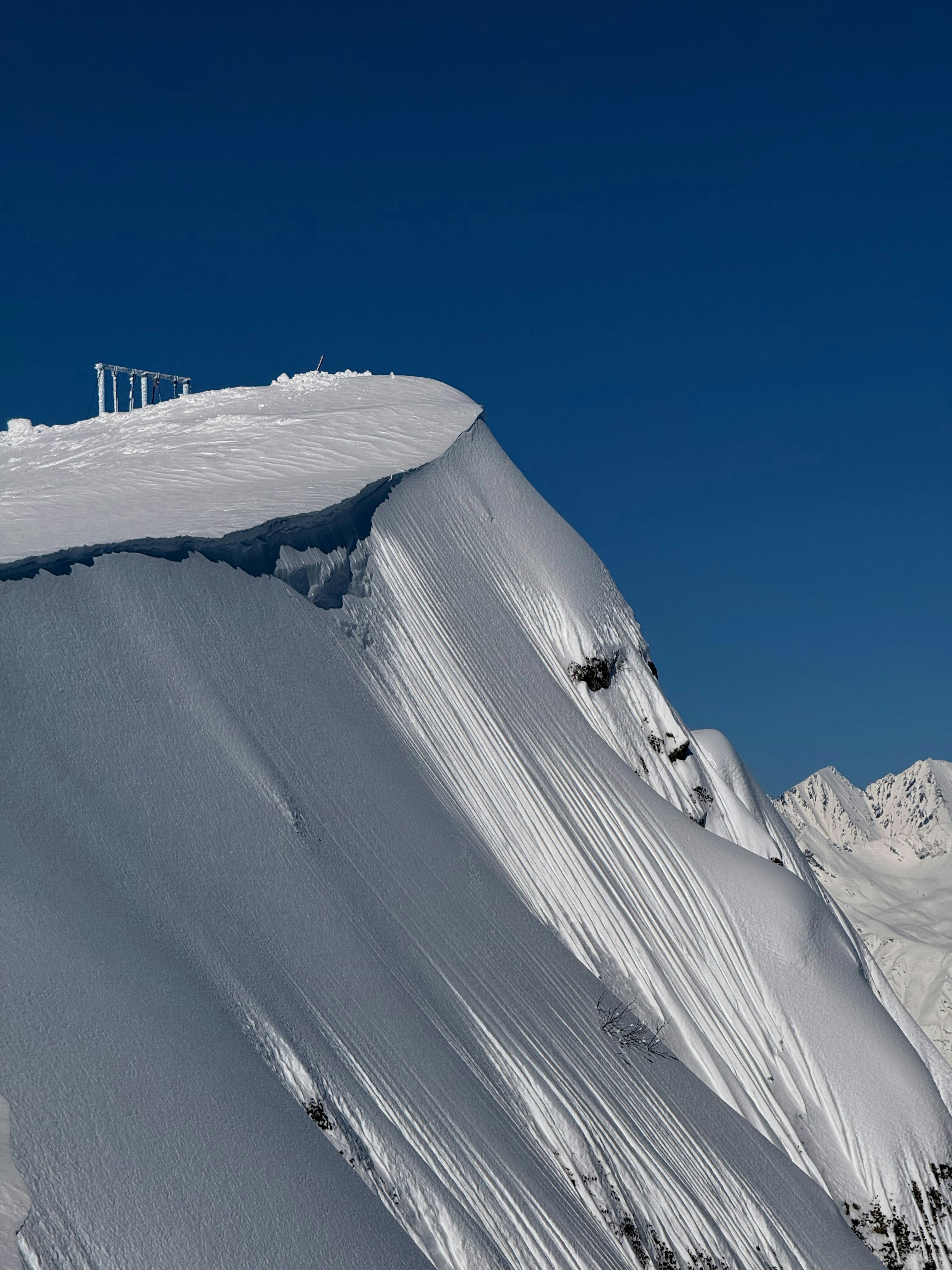 Snow-arched Ridge under a Clear Blue Sea