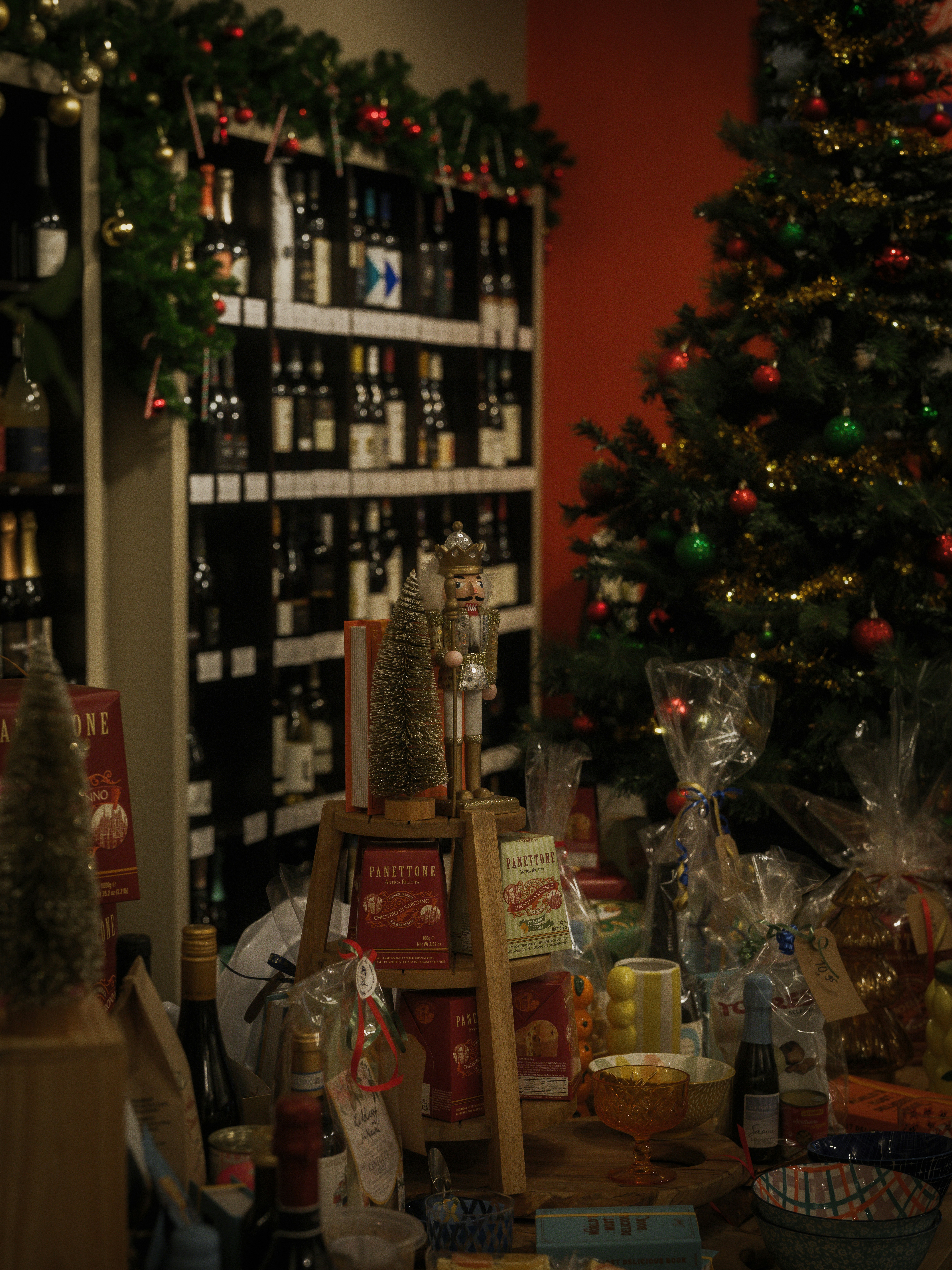 A Cozy Holiday Shelf: Nutcracker Guards the Gift-Stacked Table