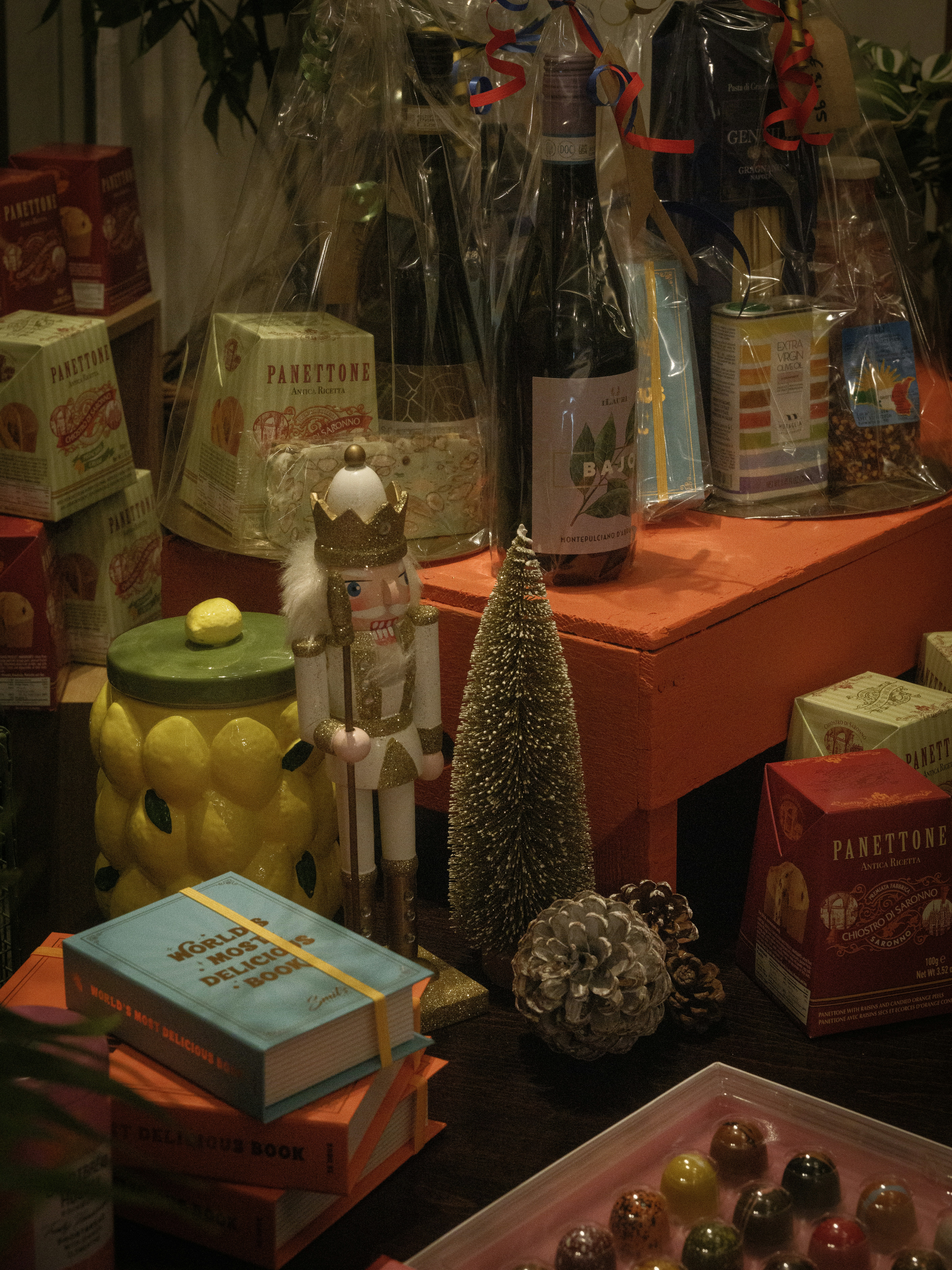 Holiday Still Life: Bottles, Chocolates, and Tiny Festive Figures