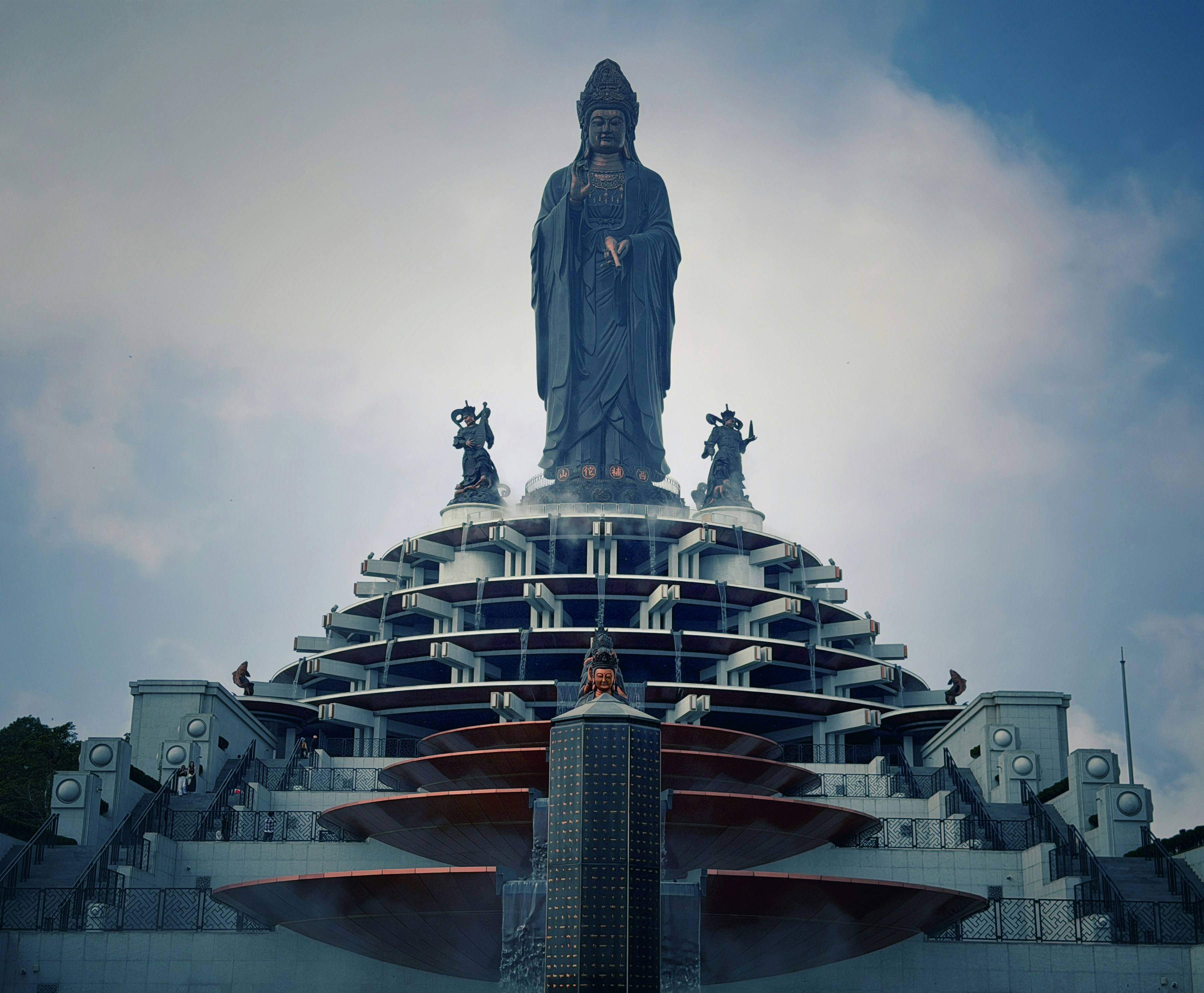 Rising Stone Guardian: The Statue atop a Tiered Sacred Staircase