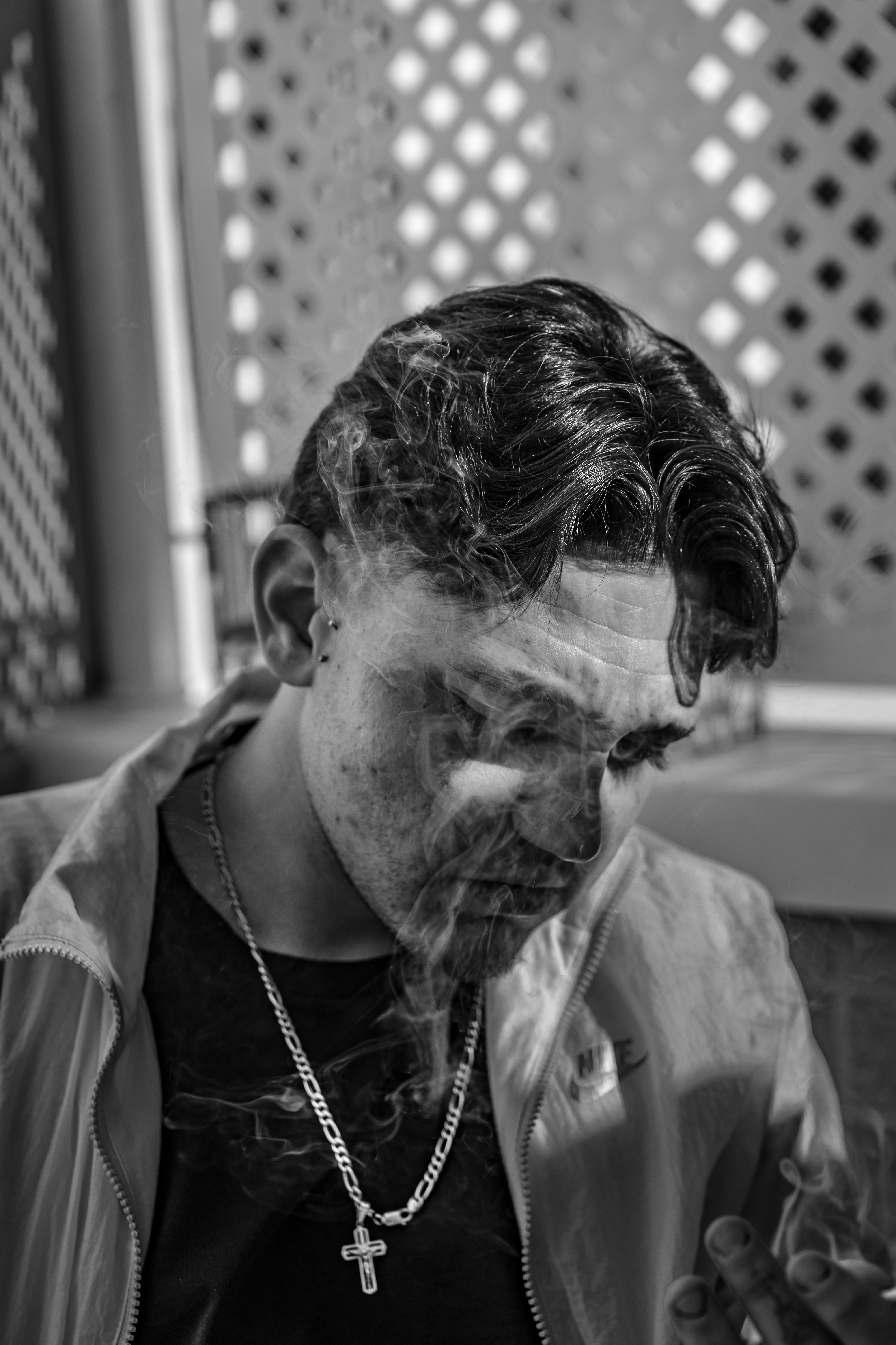 Shadowed Quietude: A Quiet Portrait Beneath Smoke and Light