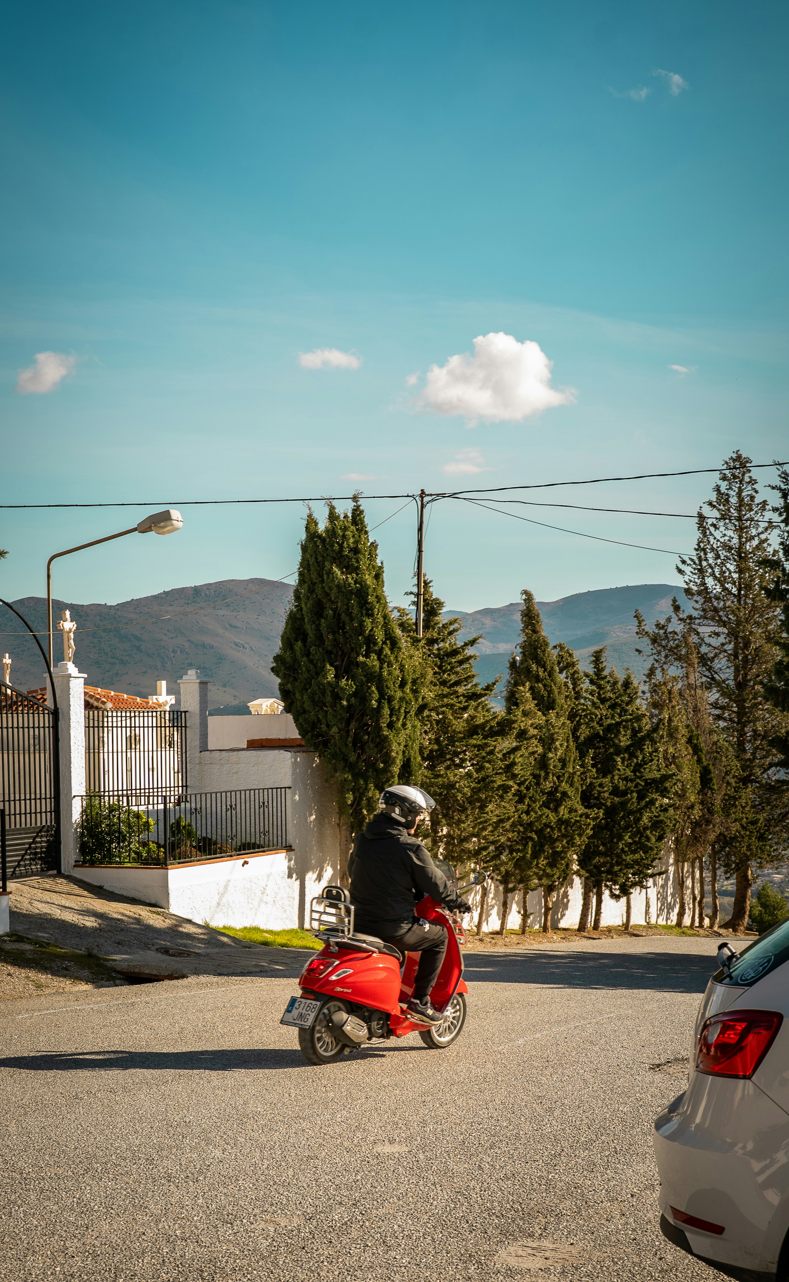 Red Scooter at a Quiet Hilltop Drive