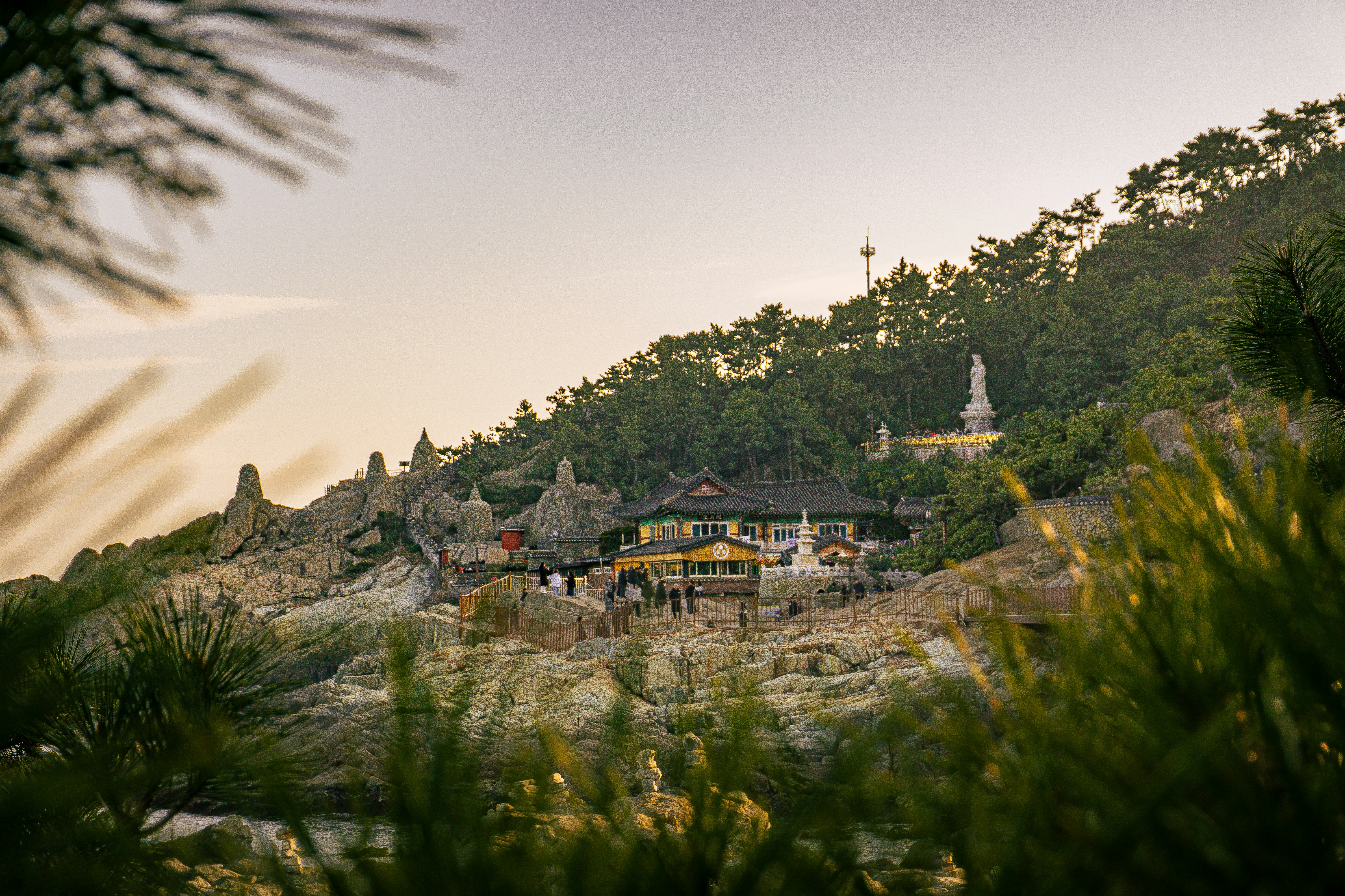 Temple Village on Coastal Rocks at Sunset