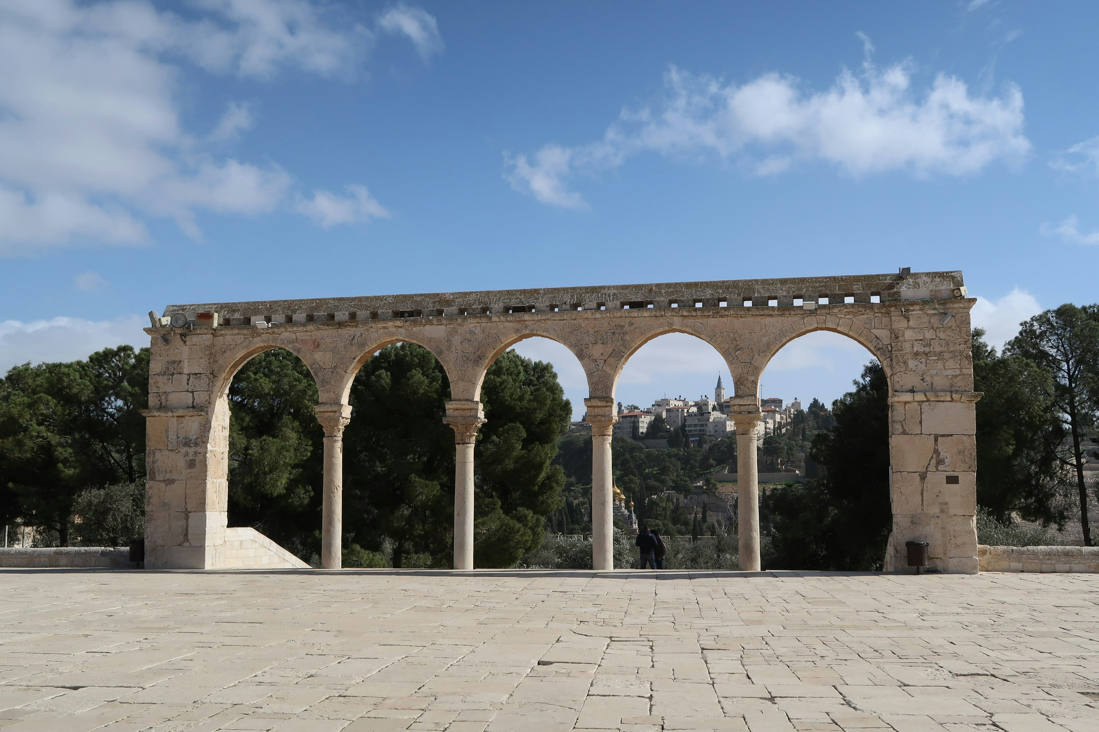 Ancient Arcade Overlooking a Walled City