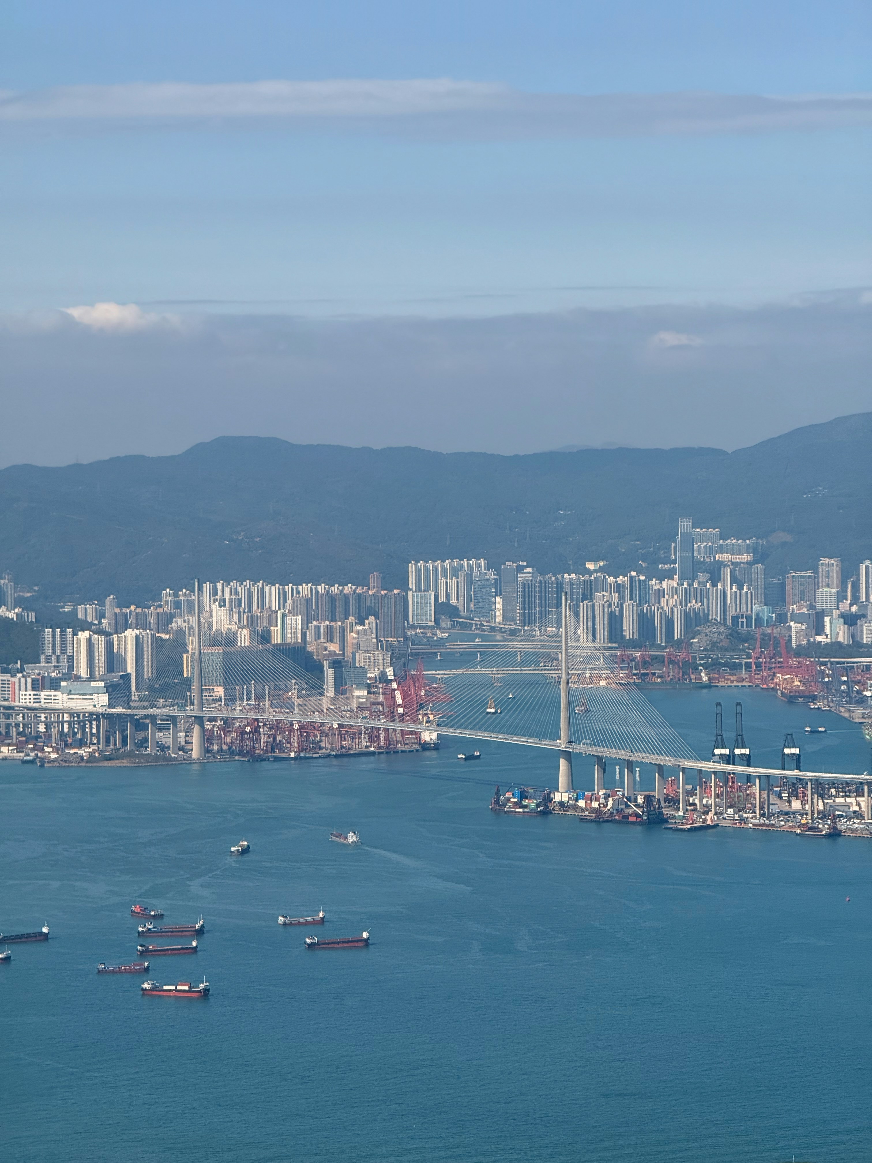 Harbor Spine: A Coastal City Framed by Distant Hills