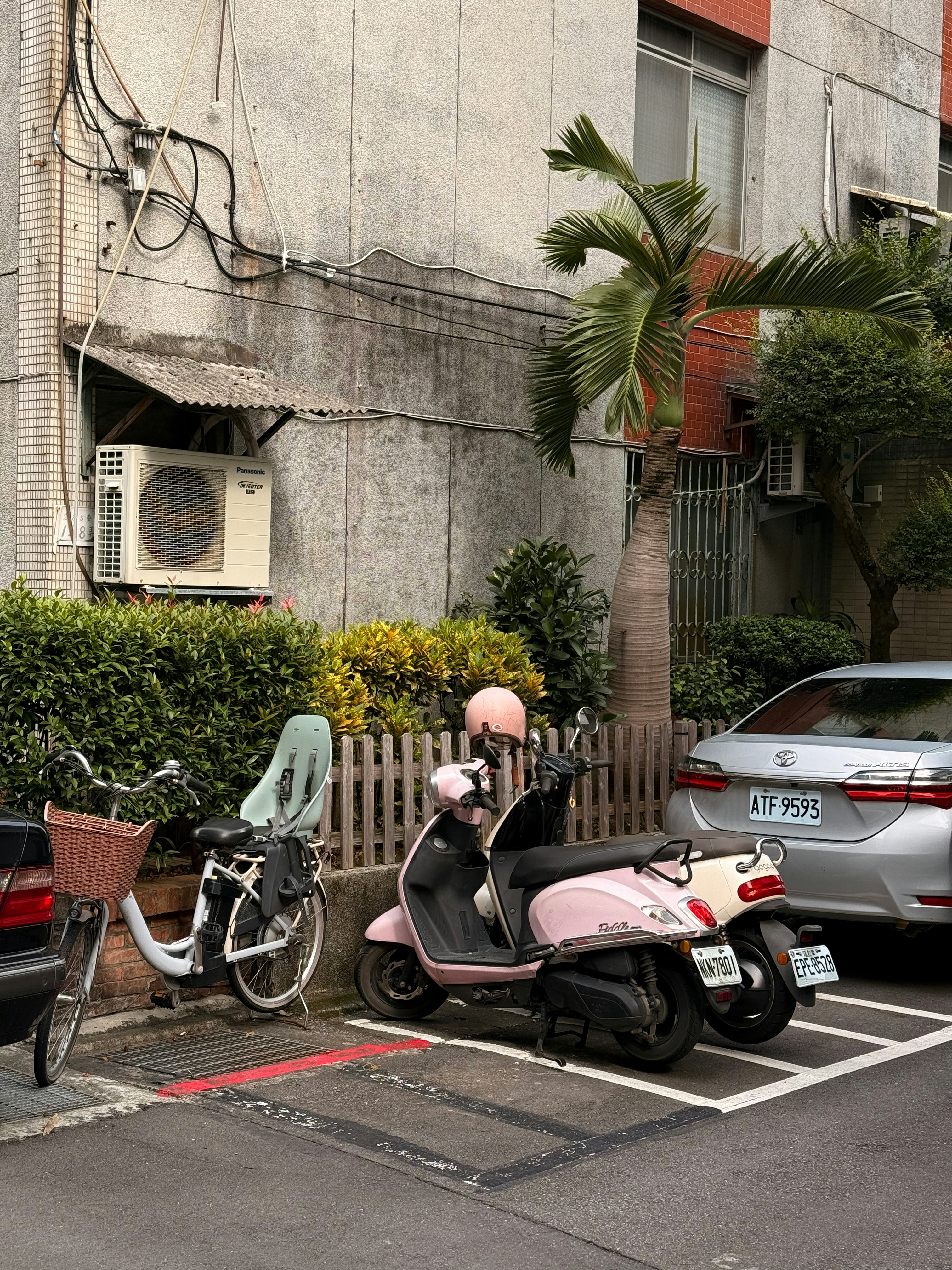 Pastel Scooters and Urban Quiet in a Taiwanese Alley