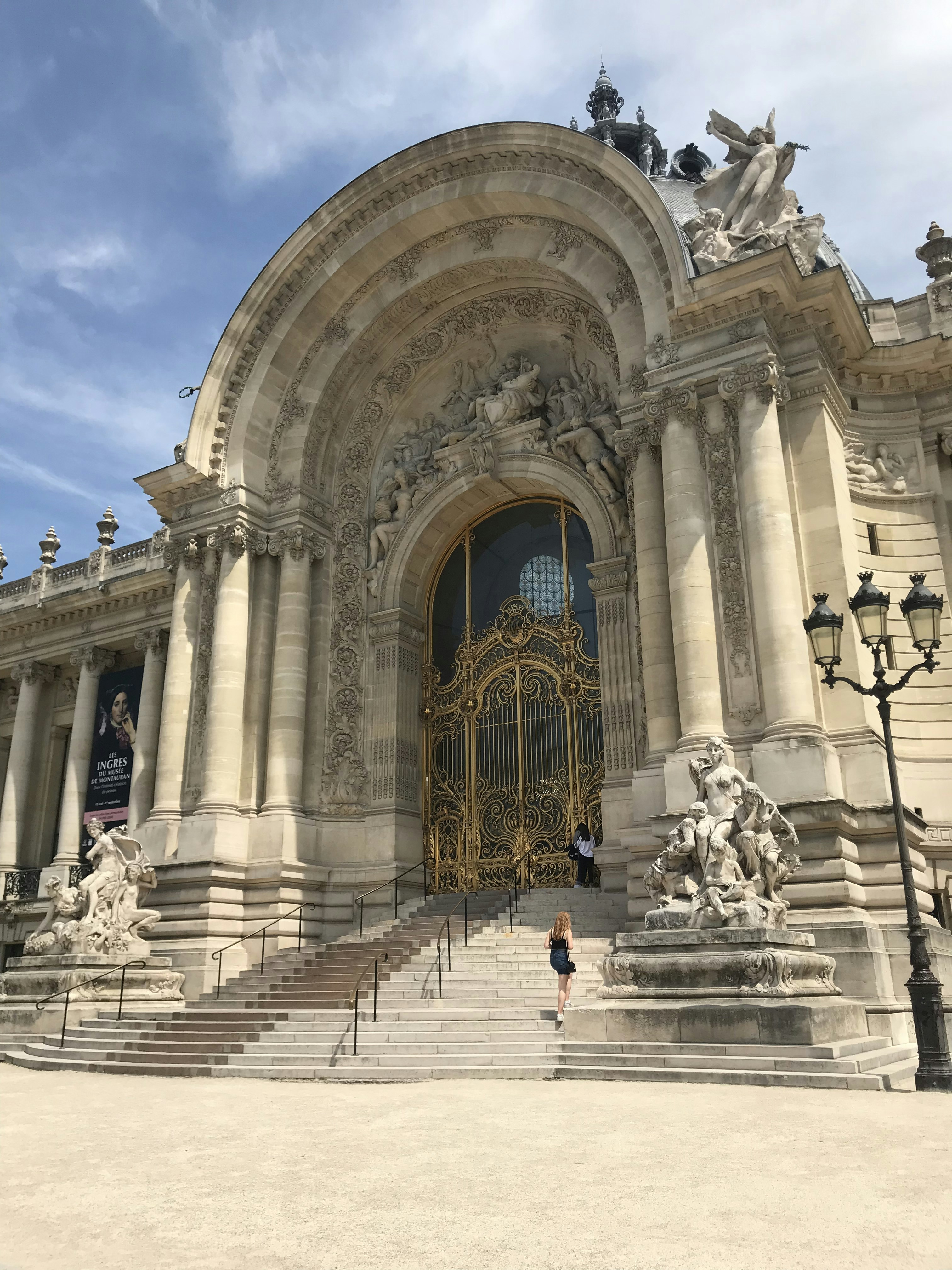 Ornate Archway and Golden Gate at Grand Museum Entrance