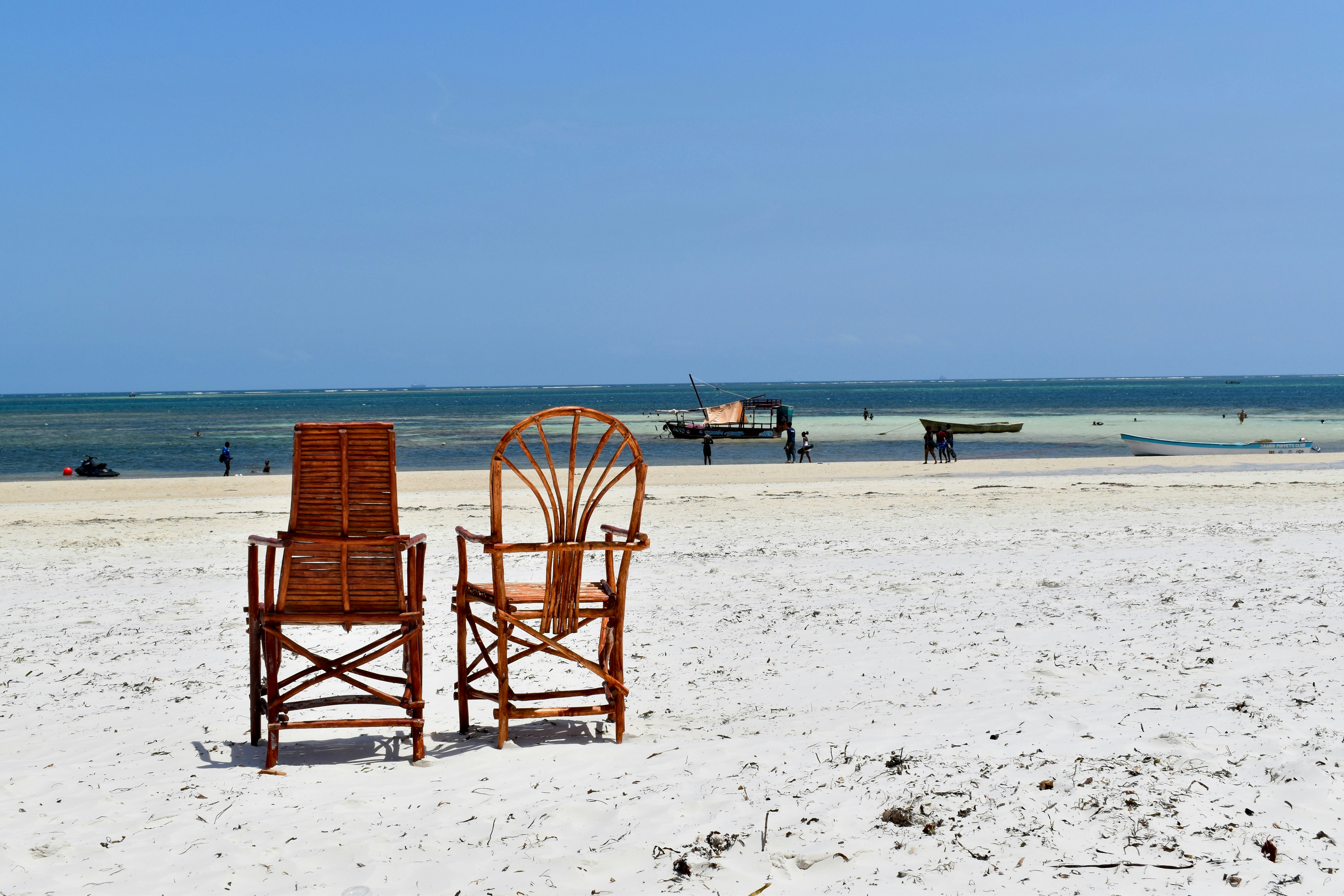 Two Wooden Chairs Watch the Sea