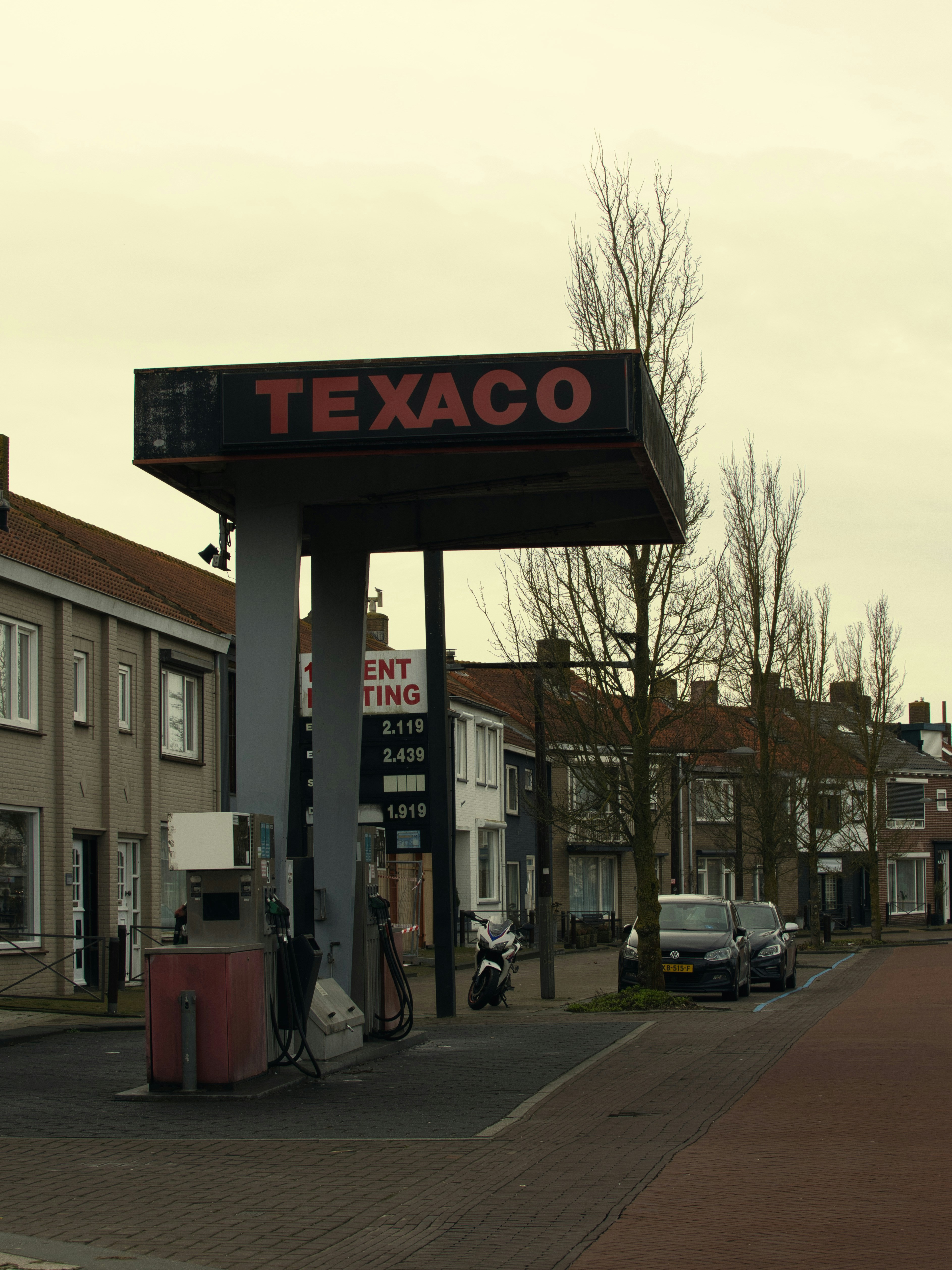 Texaco Canopy Overlook: Quiet Street at Dusk