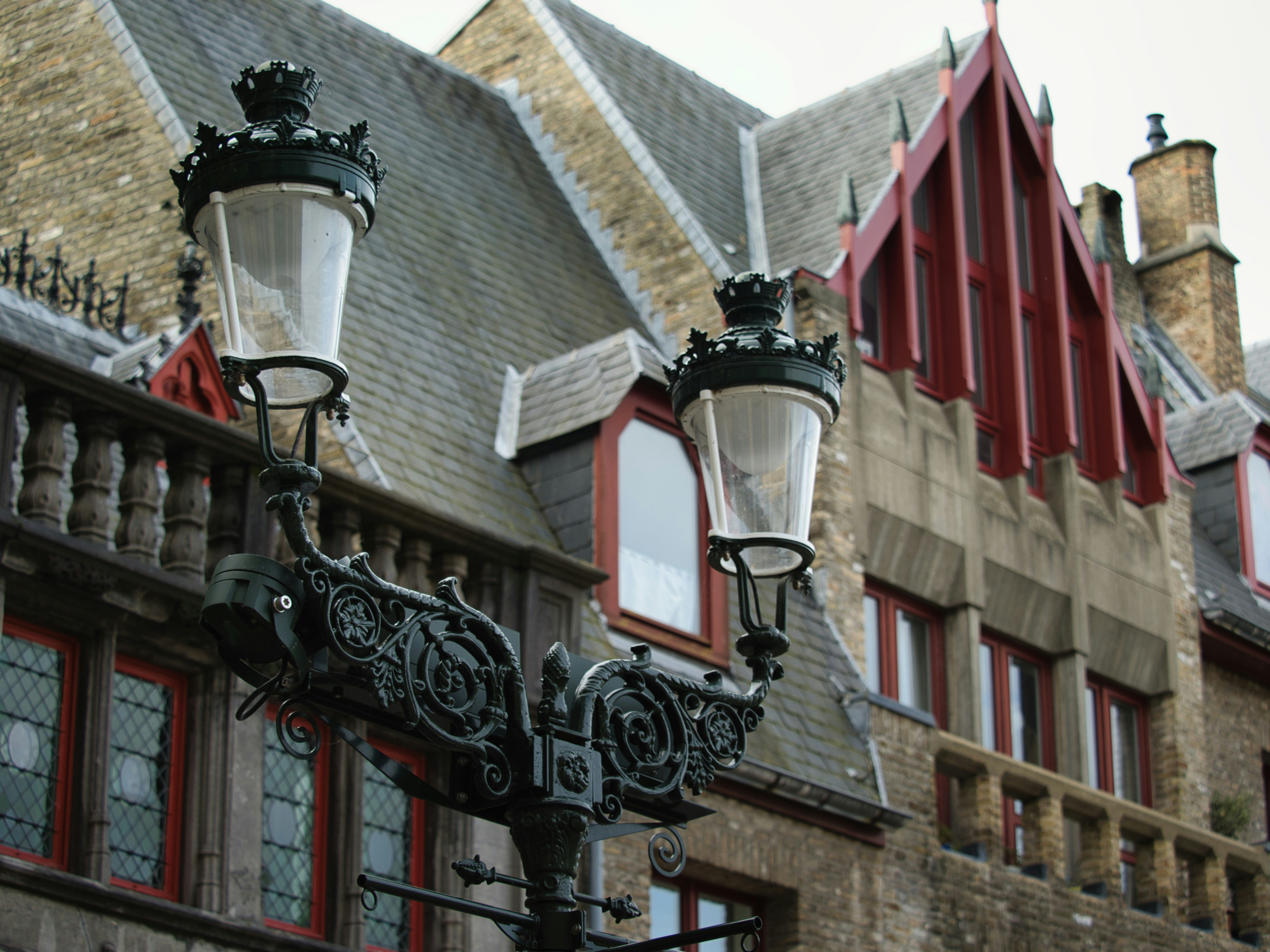 Ornate Lanterns Over a Historic Brick Facade