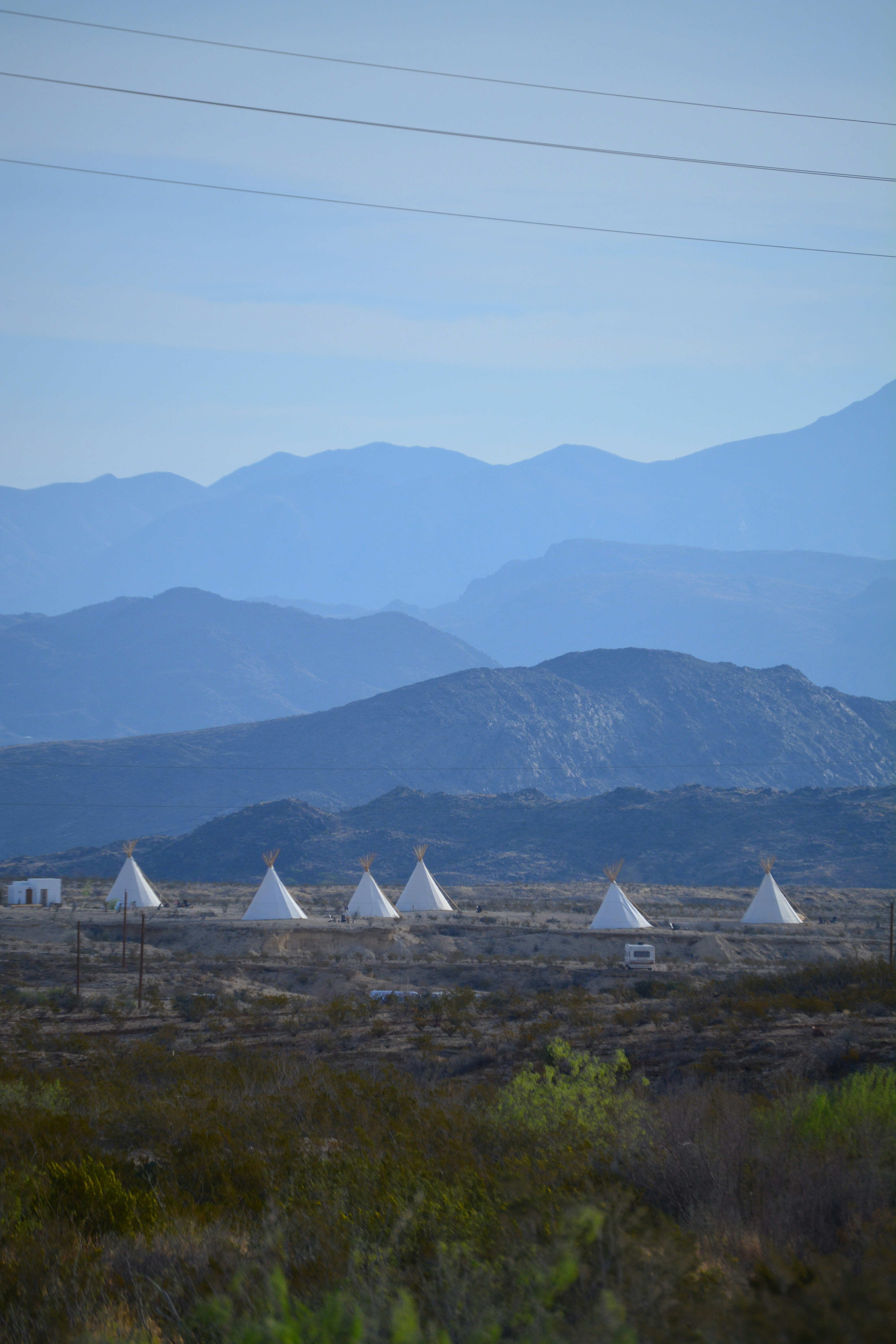Line of White Tipis Halting the Desert Horizon