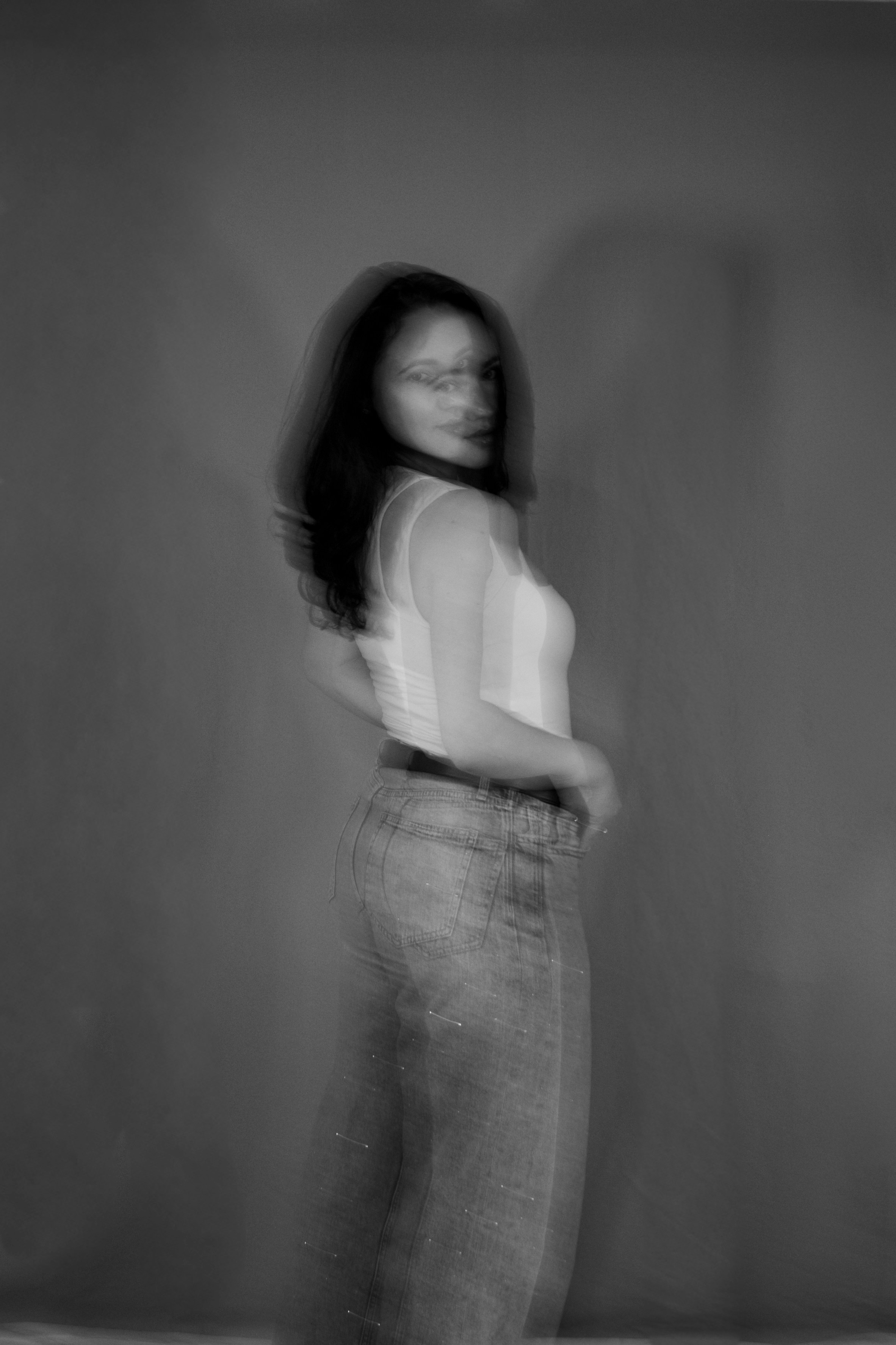 Soft Focus Portrait in Motion: A Glimpse of a Veiled Moment