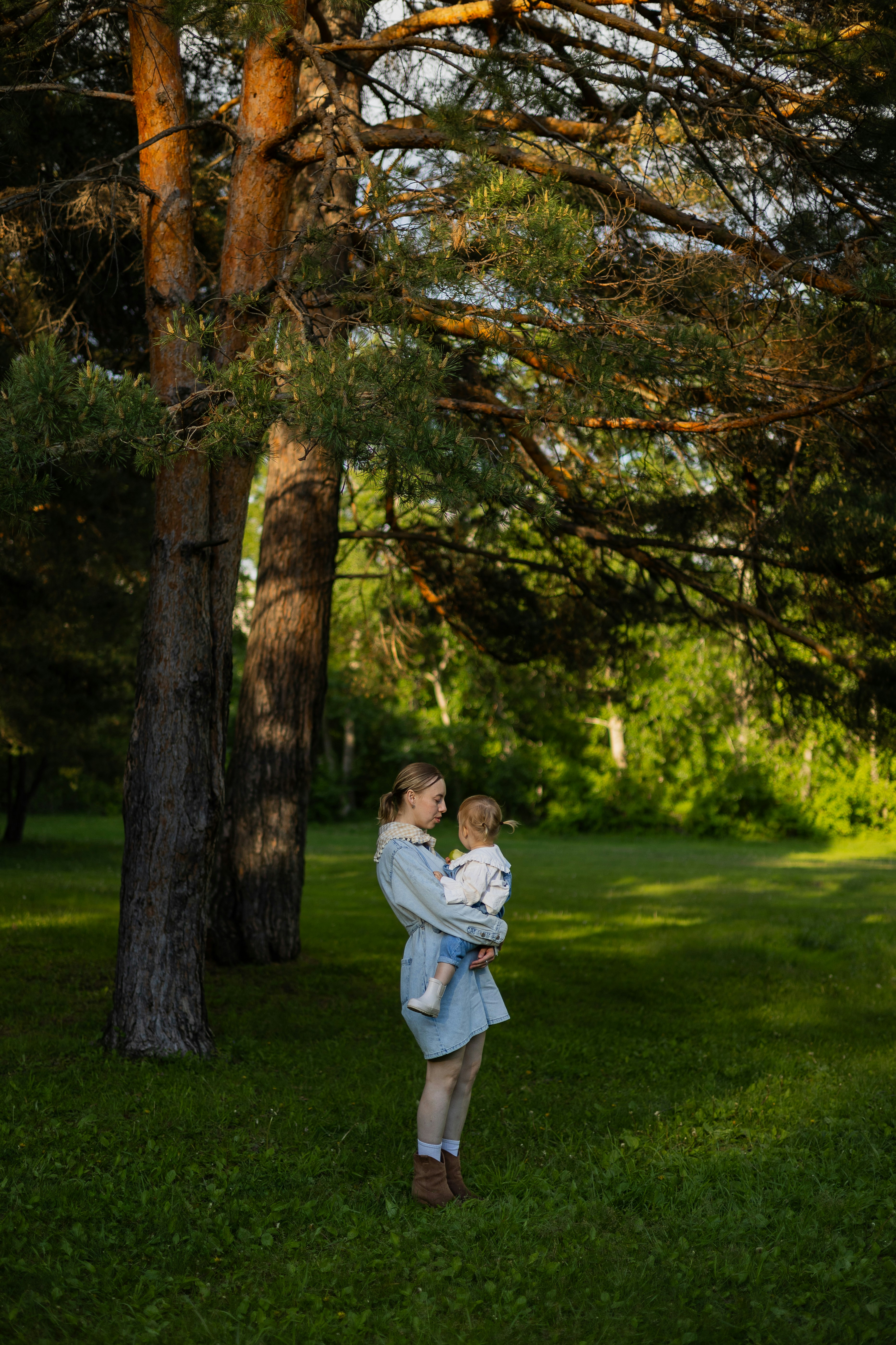 Mother and child in a sunlit grove