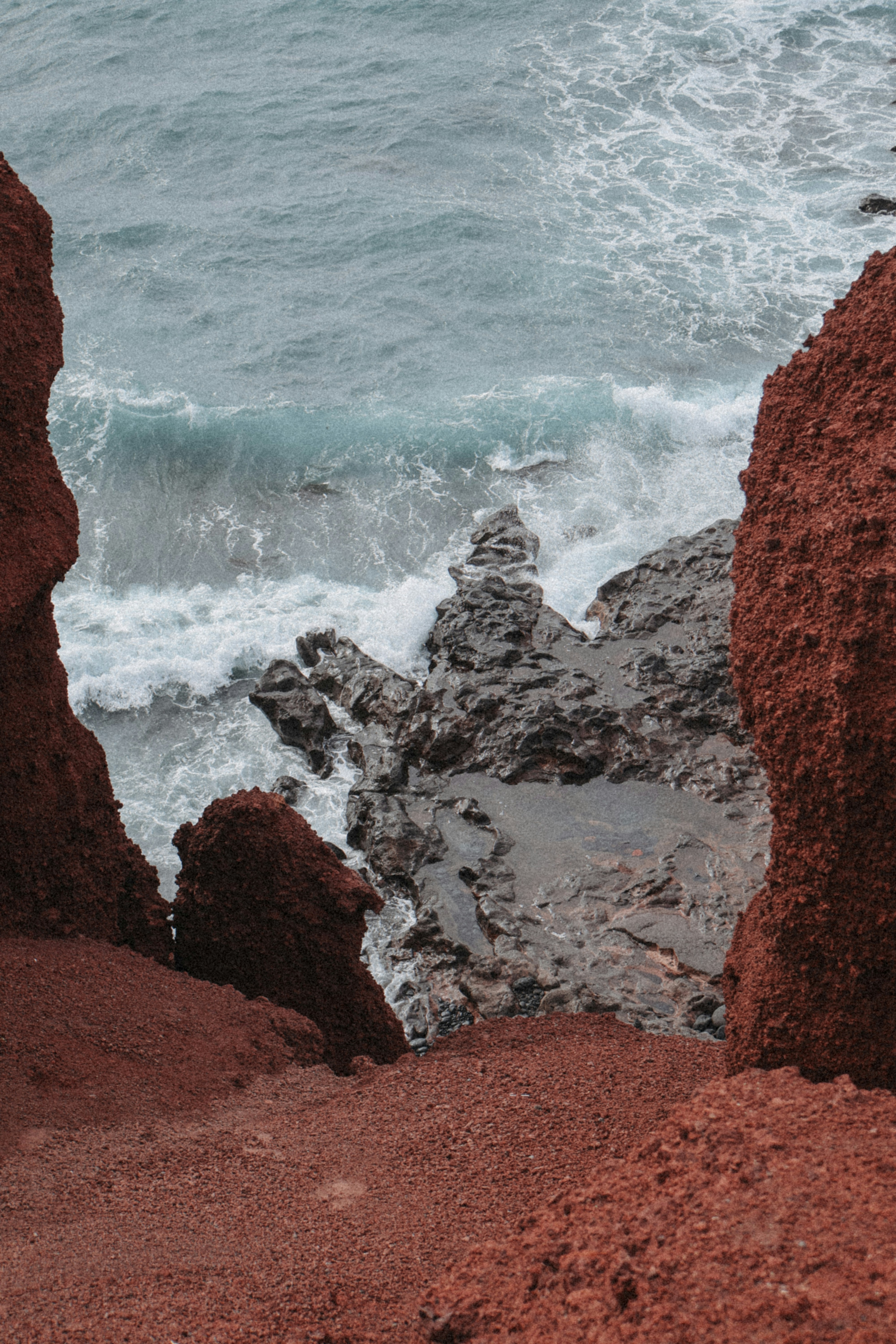 Crimson Cliff dive into the blue churn
