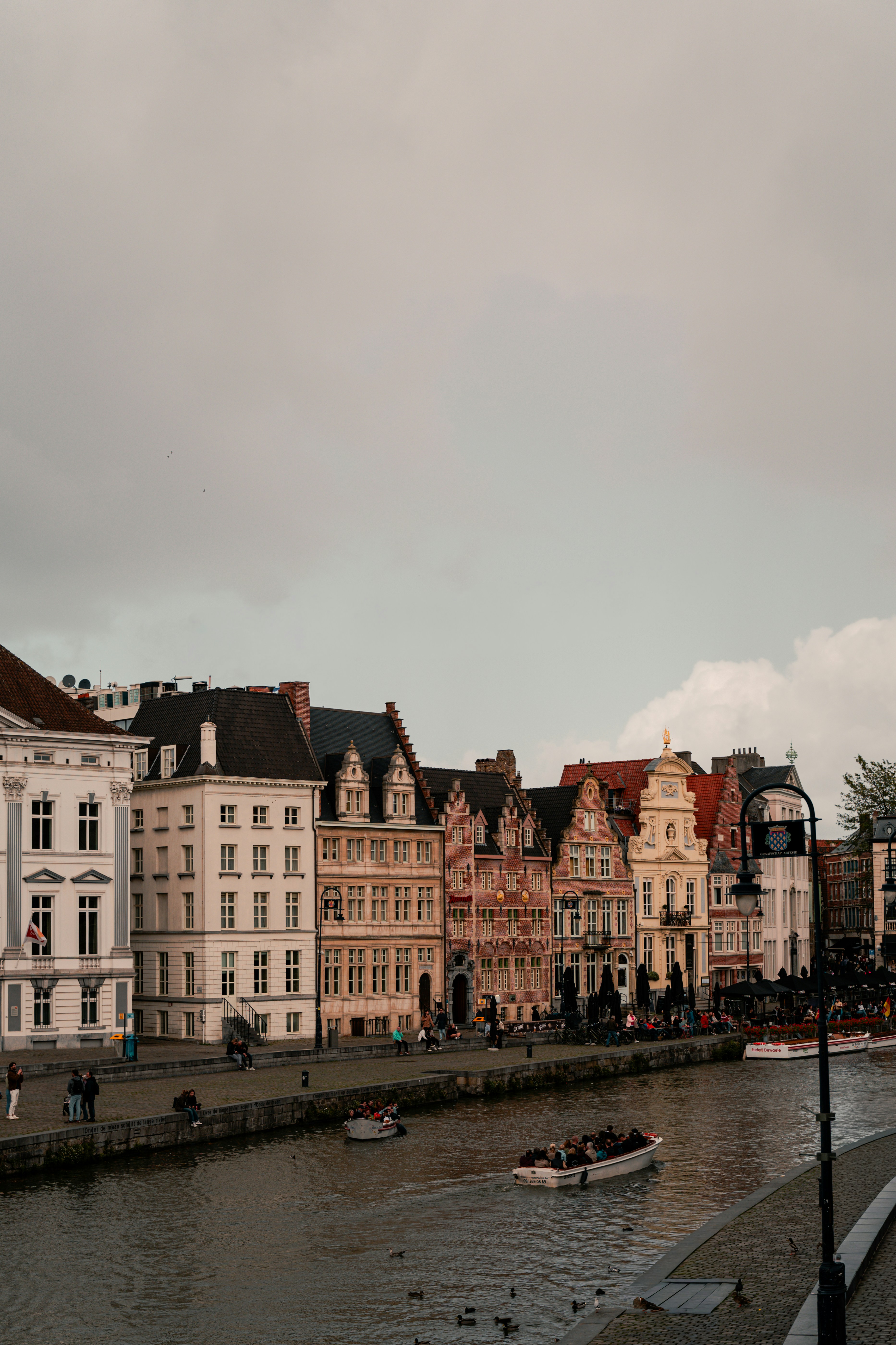 Colorful Flemish Facades Along a Quiet Riverwalk