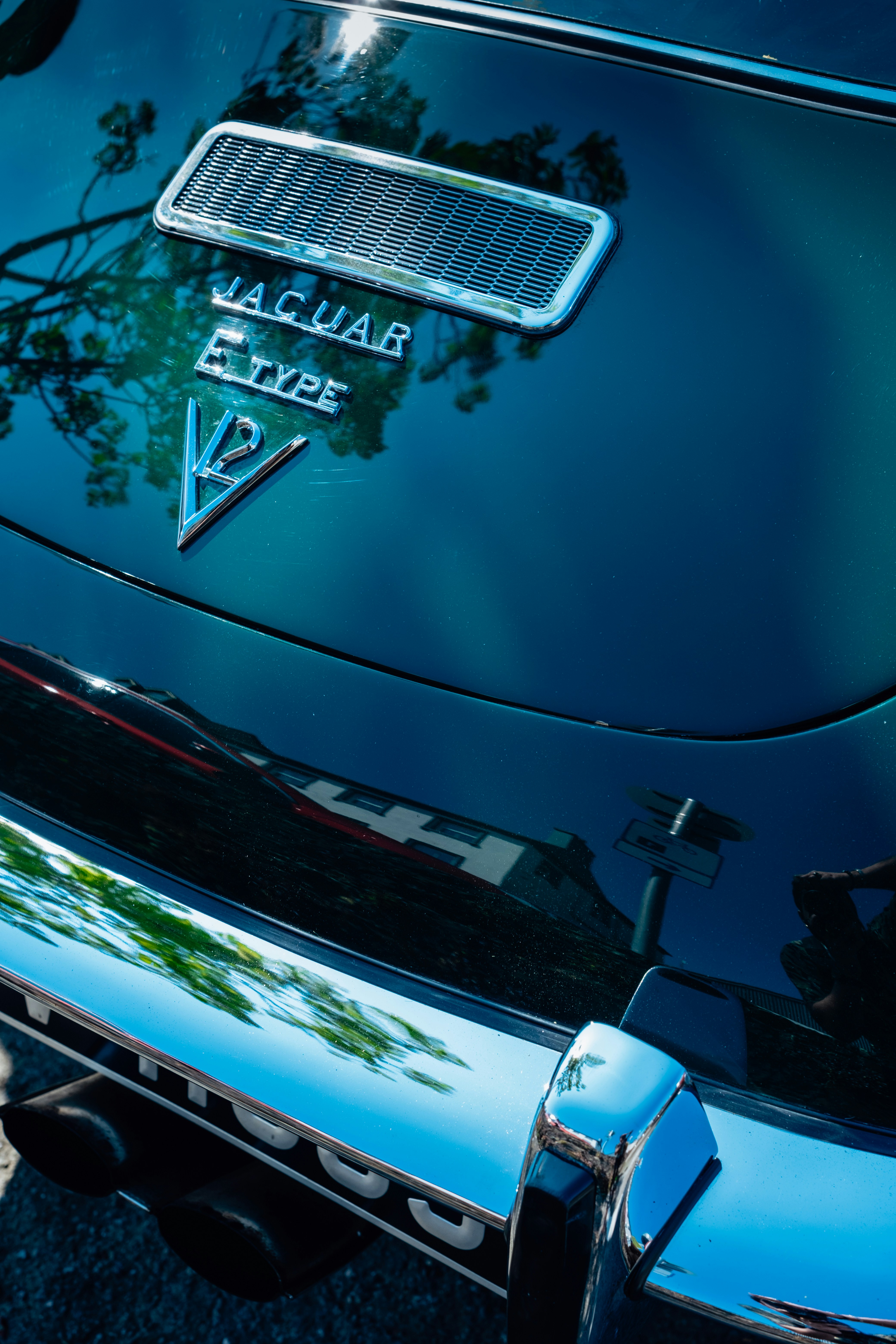 Chrome Badge Glow on a Jaguar Classic: Reflections and Lines