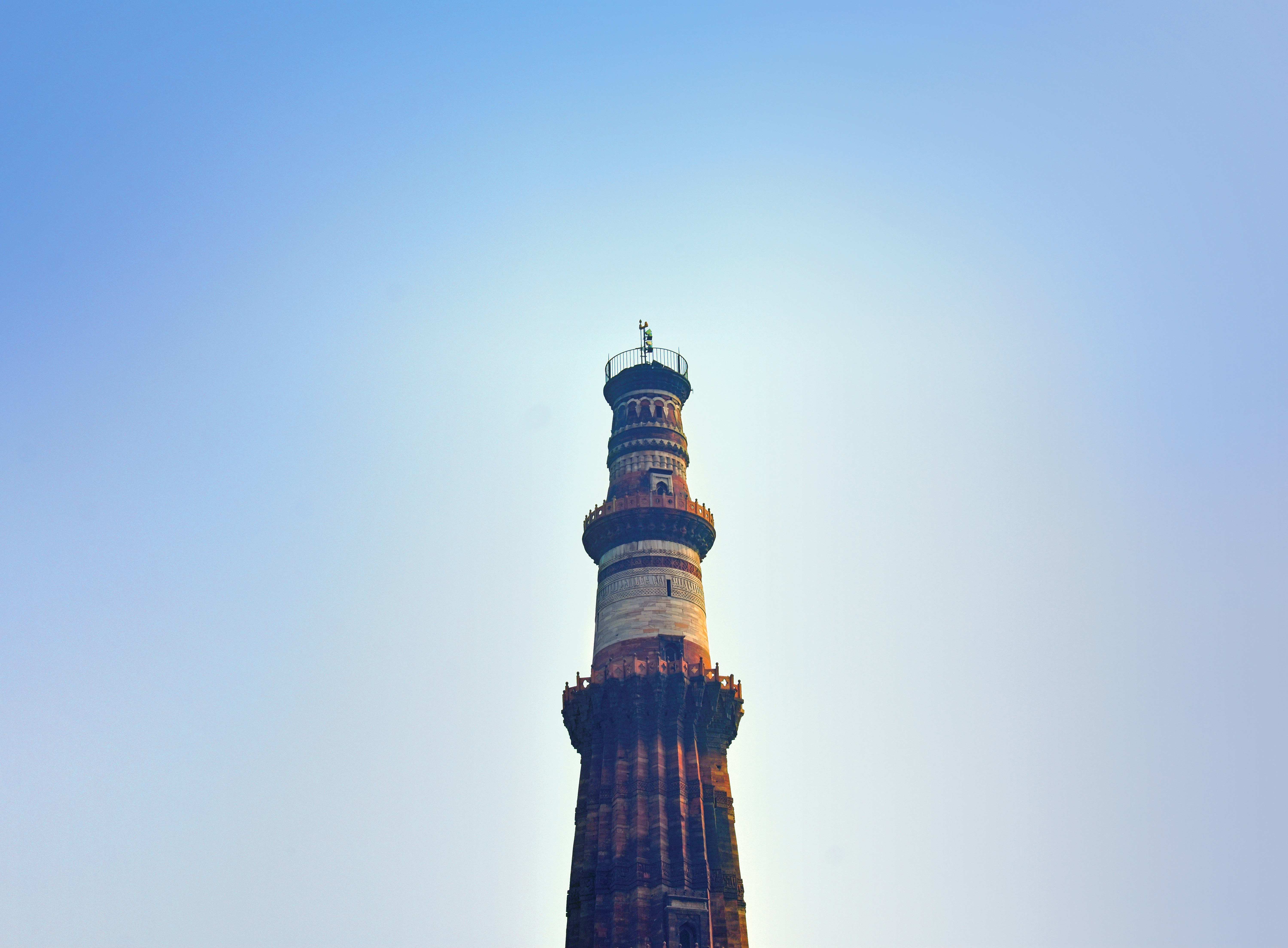 Beacon in the Sky: A Solo Lighthouse Reaching Toward the Sun