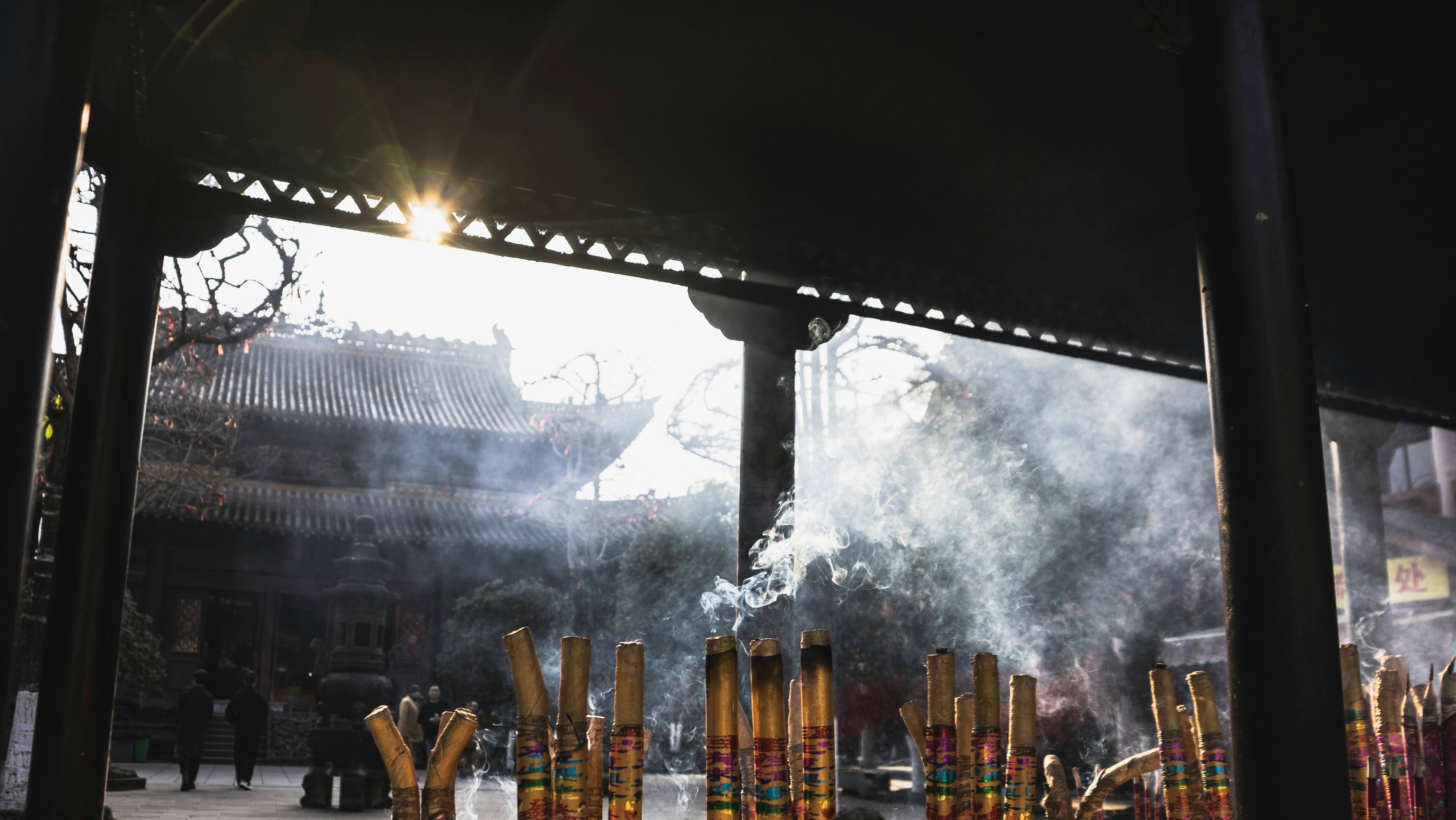 Sunlit Temple Shadows and Incense Barrages