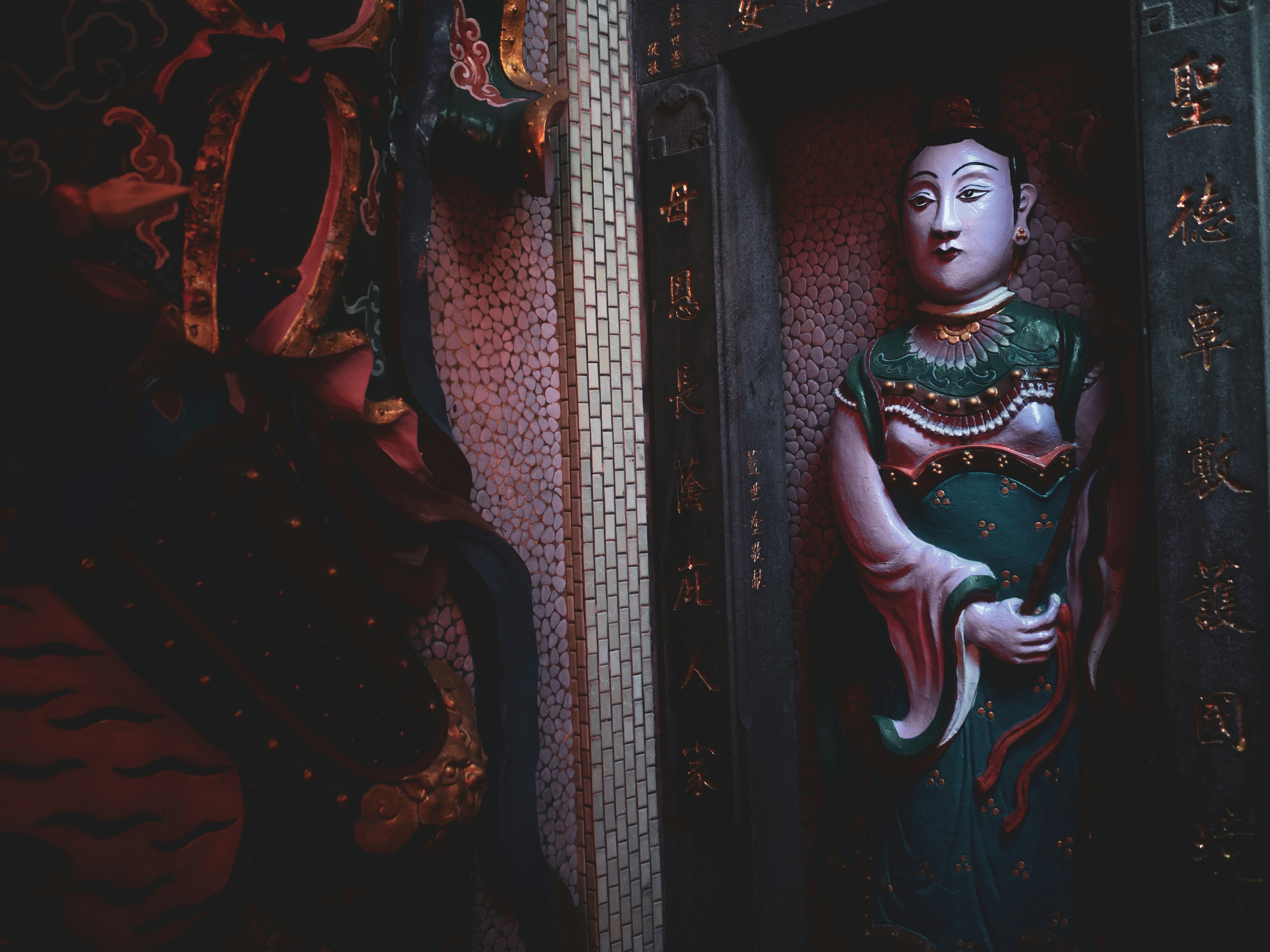 Guardian in Red and Jade: A Stoic Figure Amid Classical Carved Doors