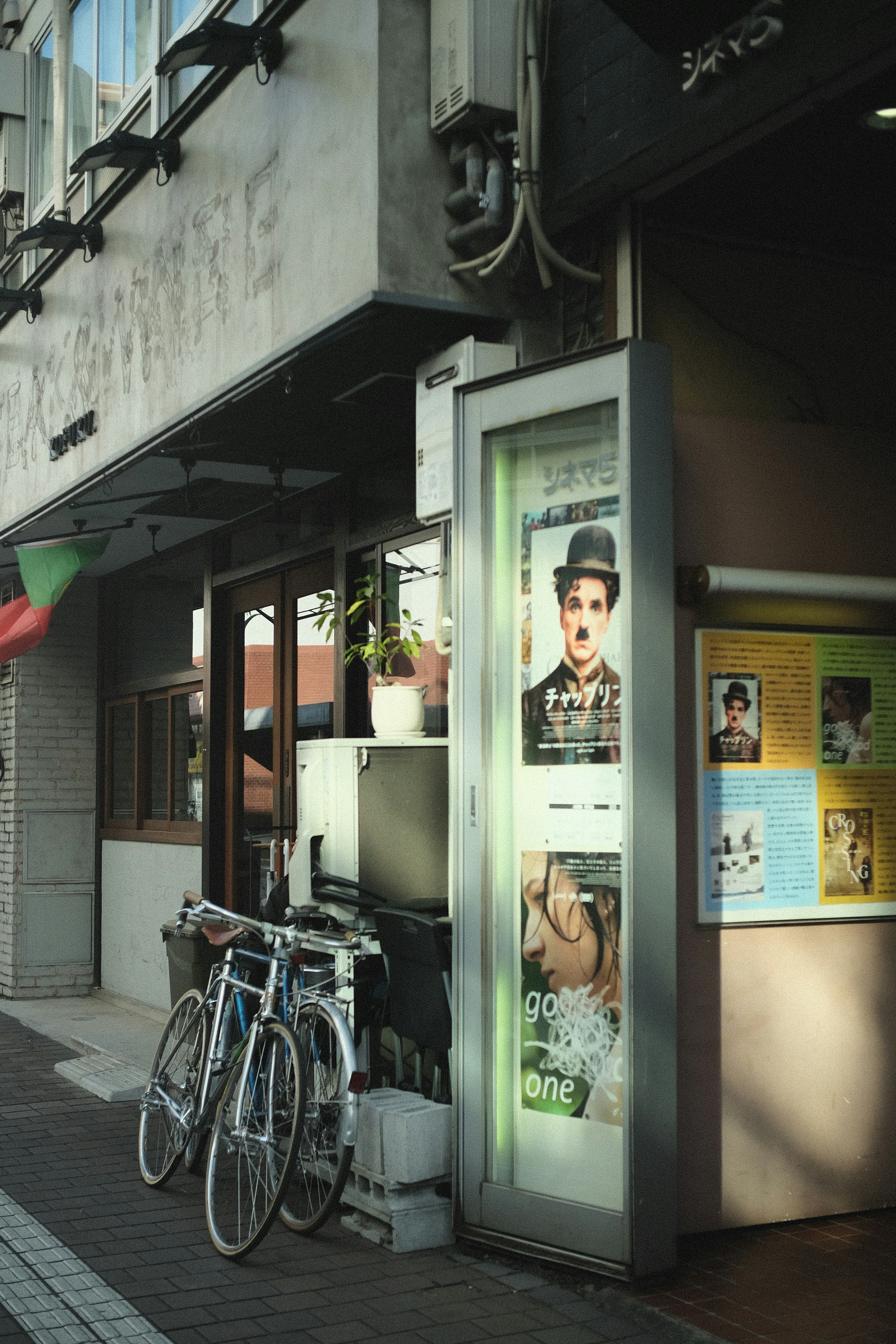 Urban Corner: Bikes, Posters, and a Quiet Shopfront