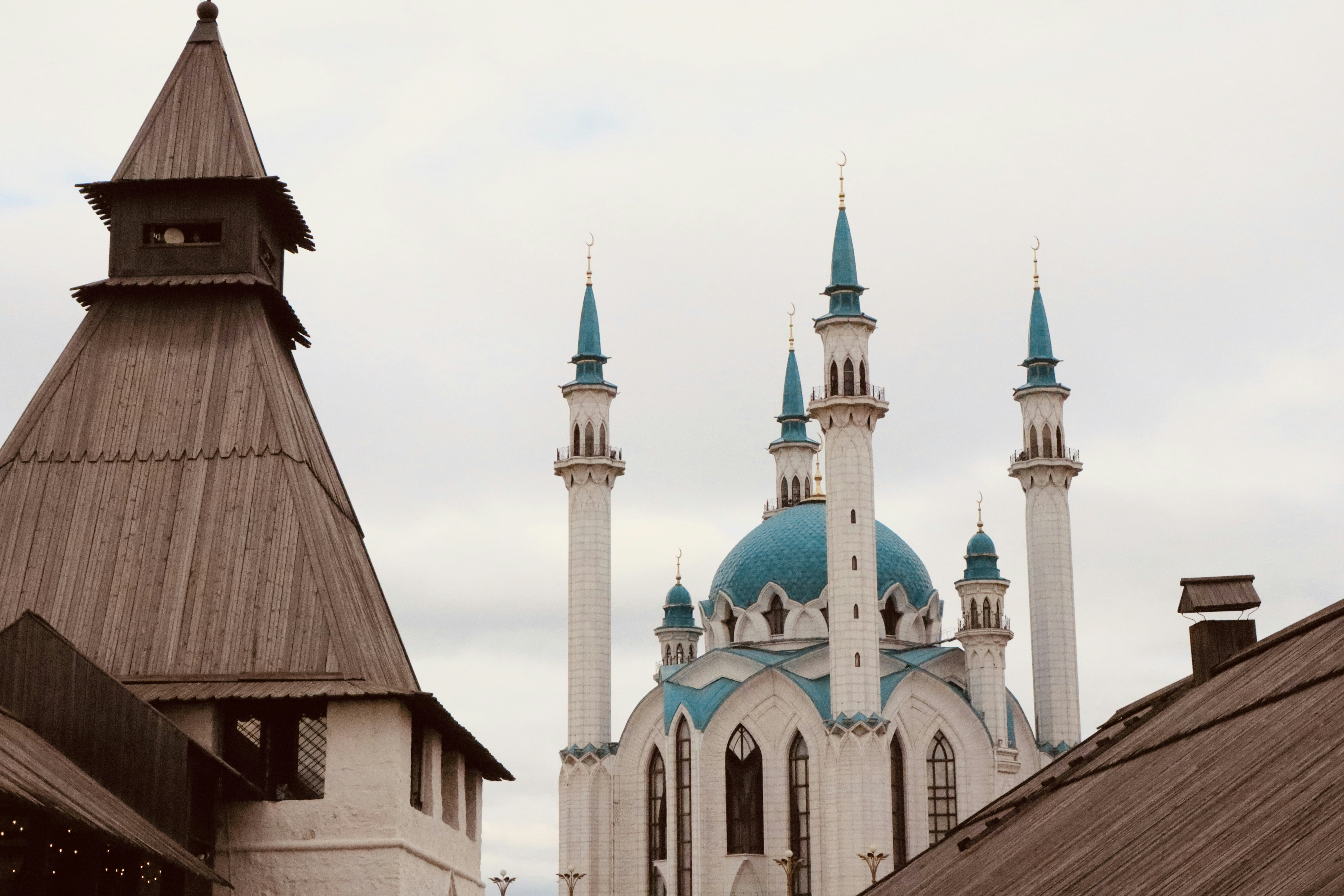 Blue-domed Minarets Rising Over Rustic Rooftops