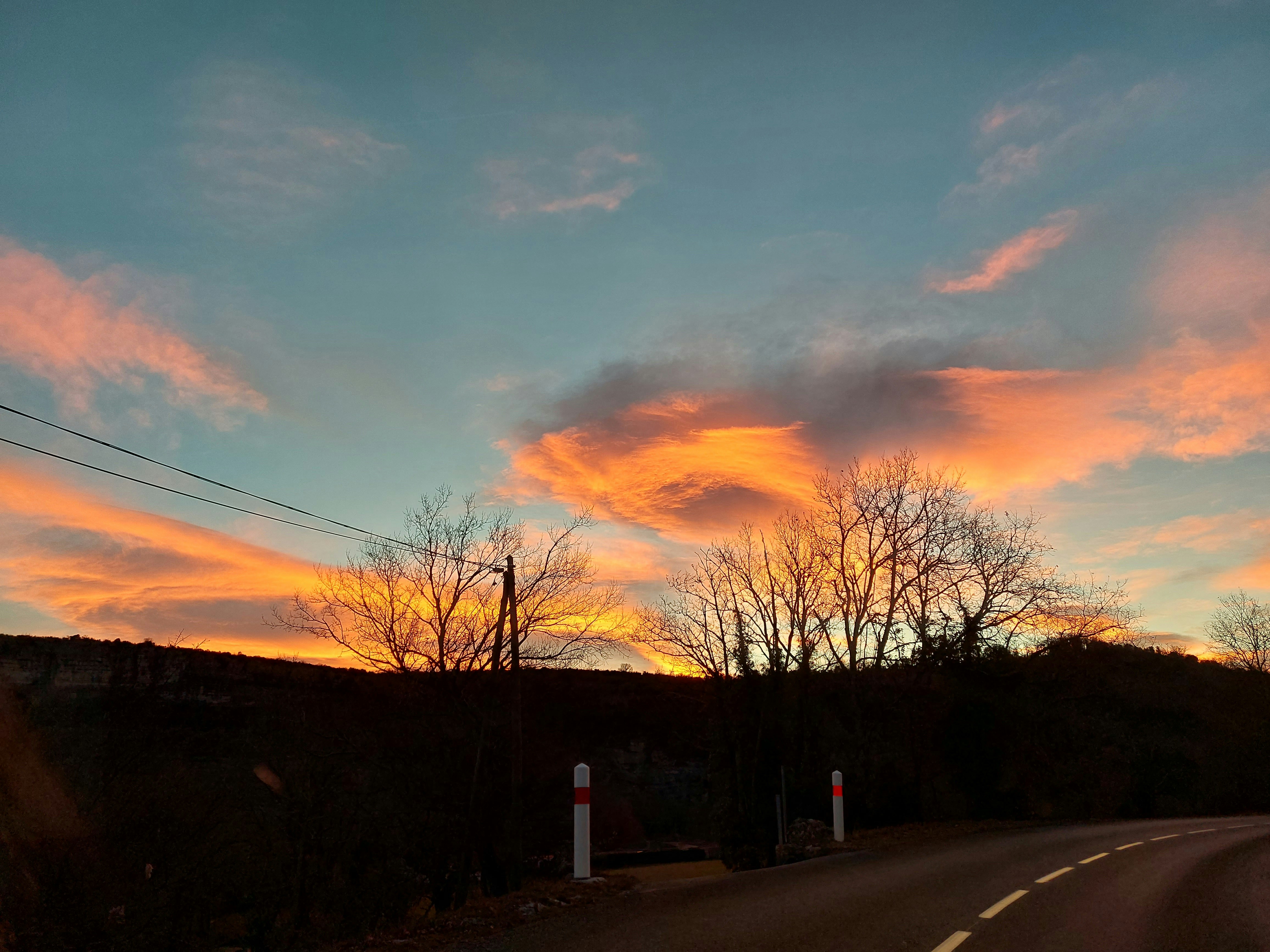 Sunset Breathe: Silhouetted Road Meets Fiery Sky