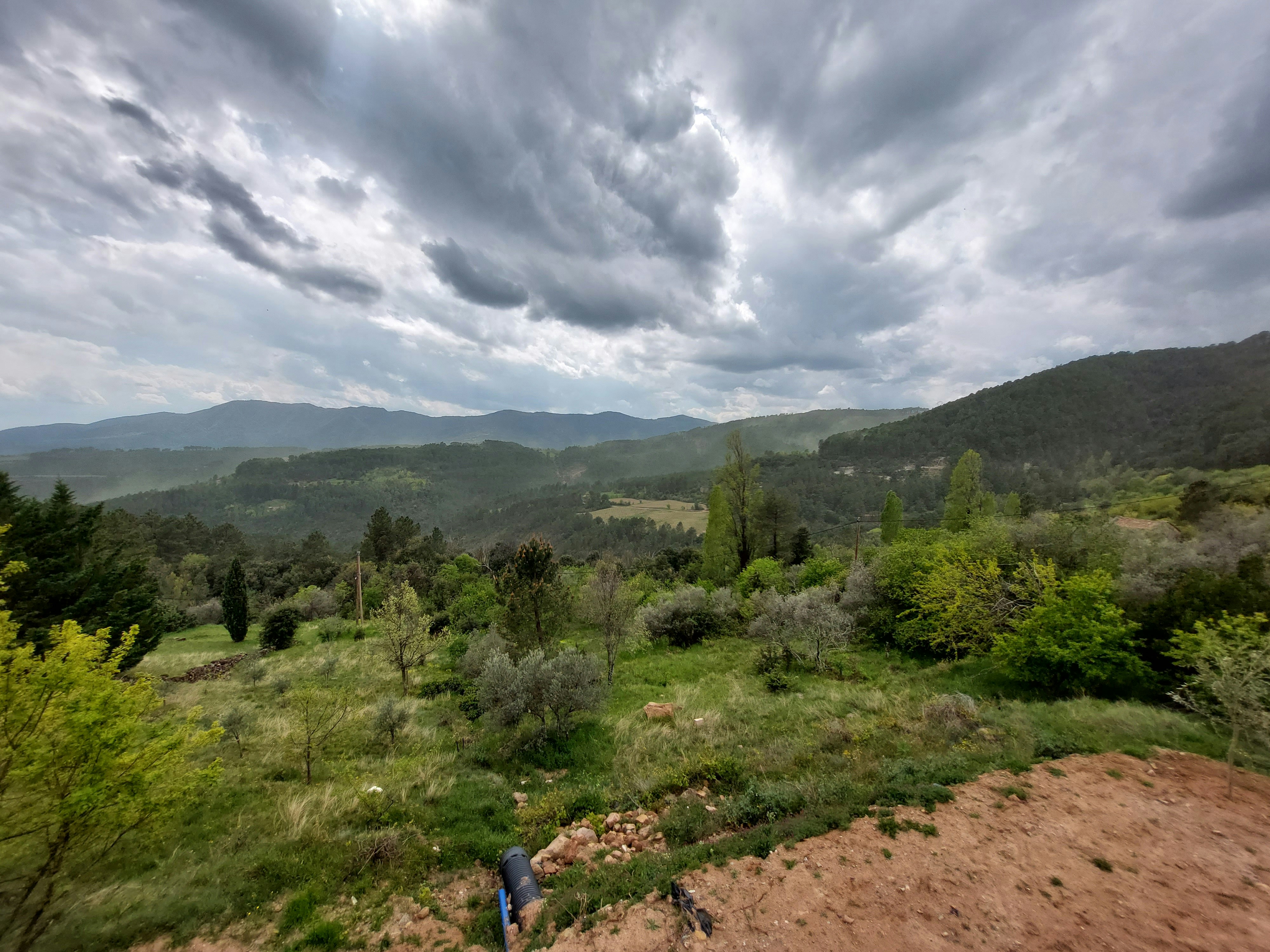 Rolling Hills Under Tempestuous Skies