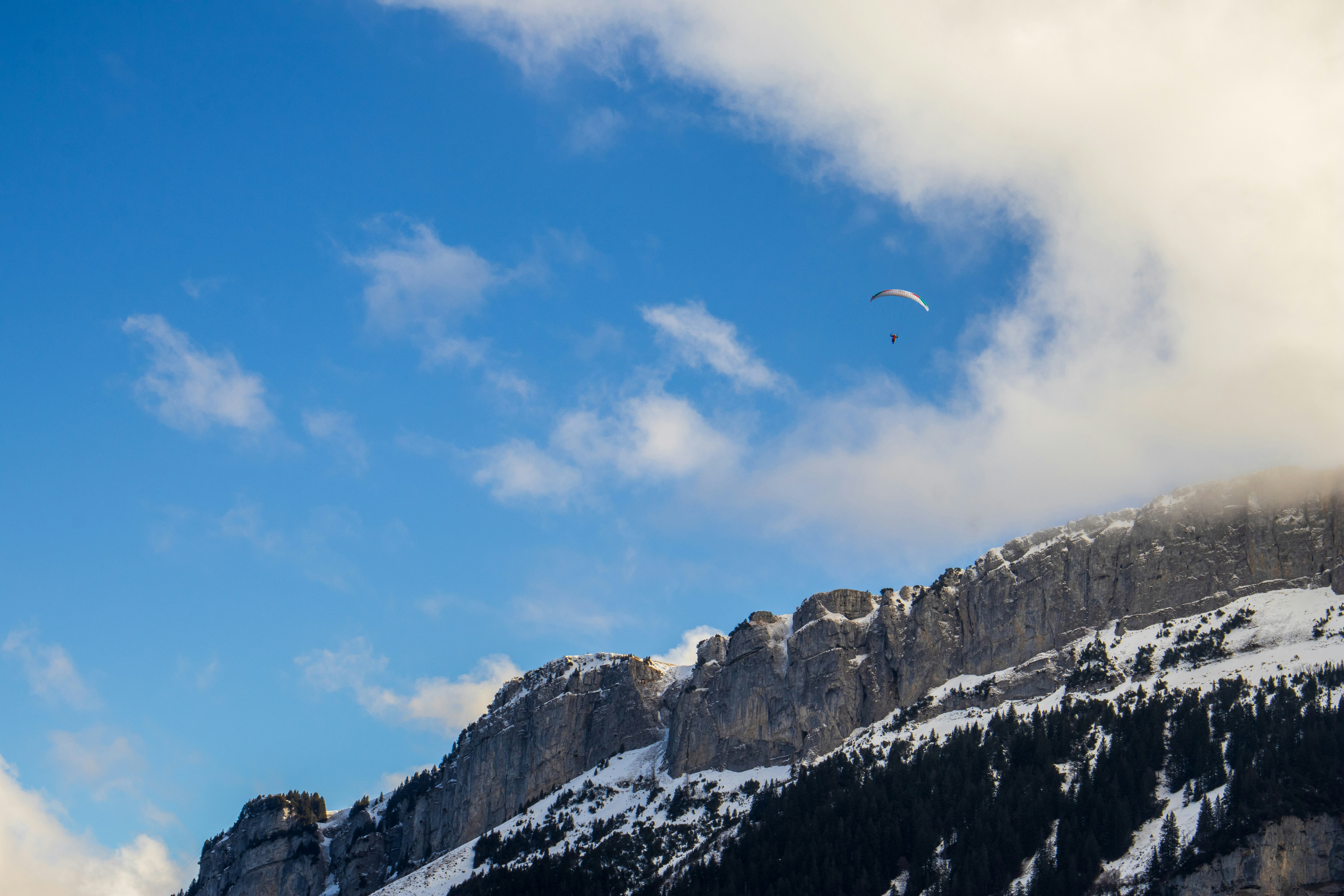 Sky Dance Over Snow-Capped Ridge