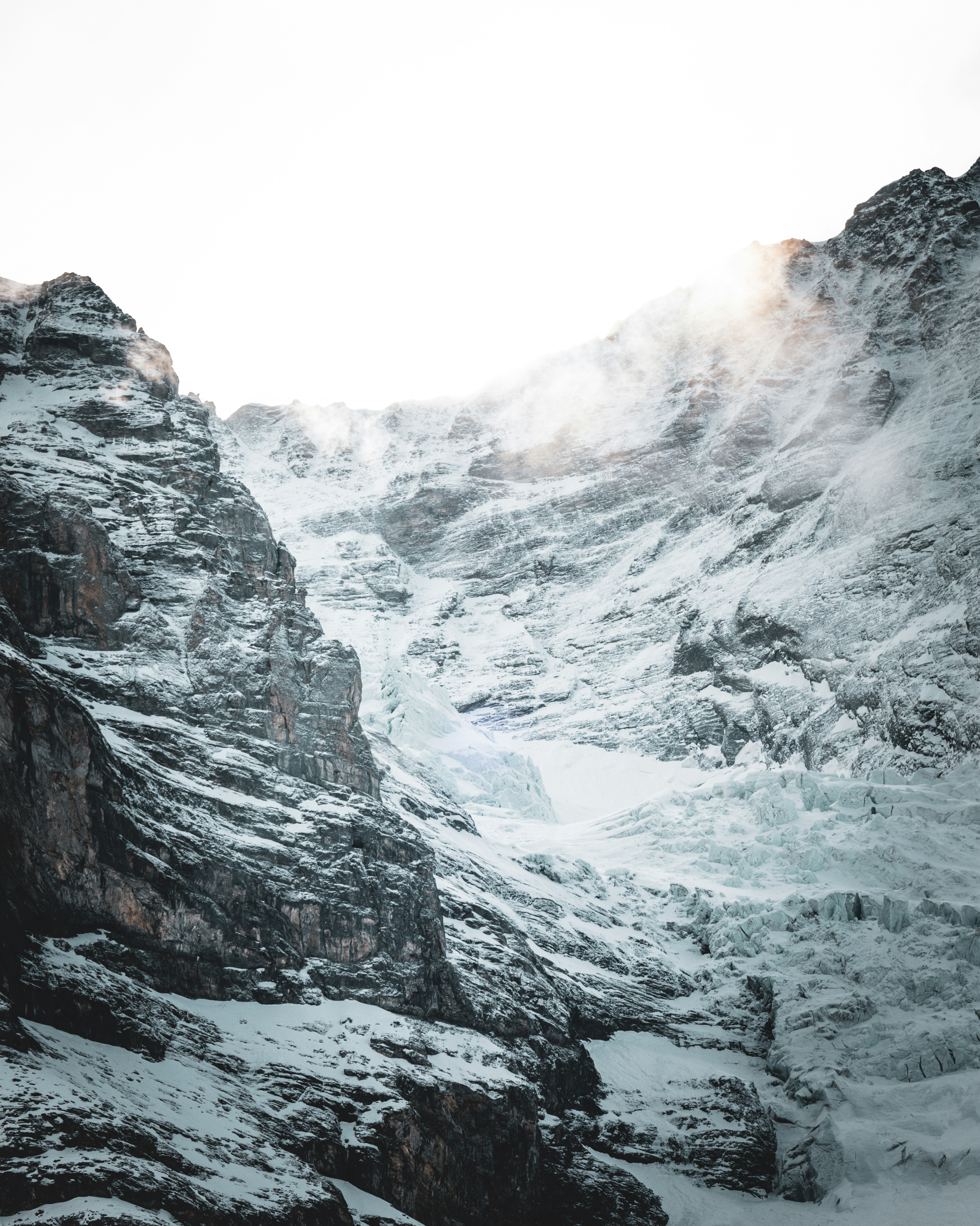 Glacial Chasm: Morning Light Over Frosted Peaks