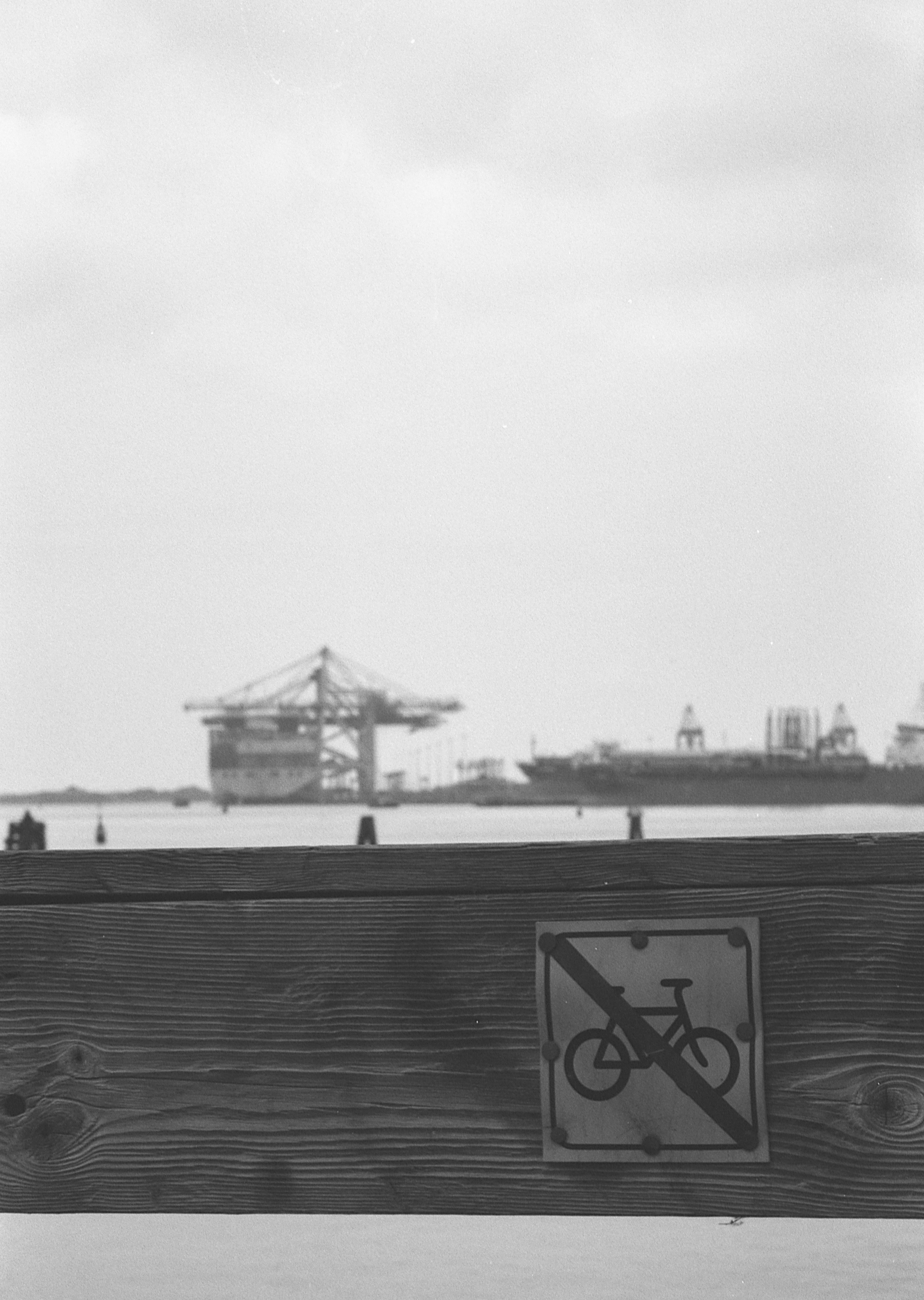 Harbor Silhouette Beyond the Weathered Pier